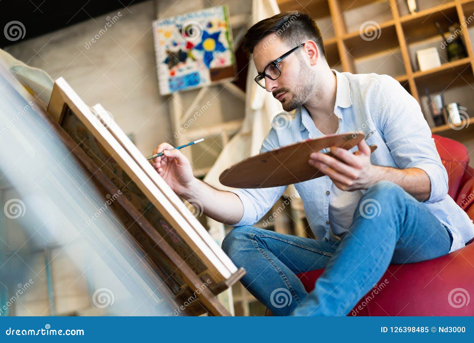 Young Man Painting on Canvas Stock Image - Image of artwork, paintbrush ...