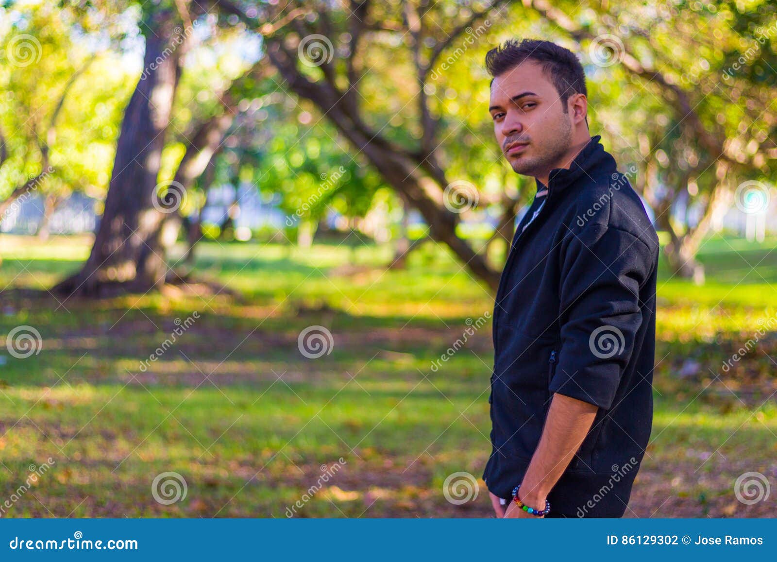 Young man in a park stock photo. Image of greenery, hike - 86129302