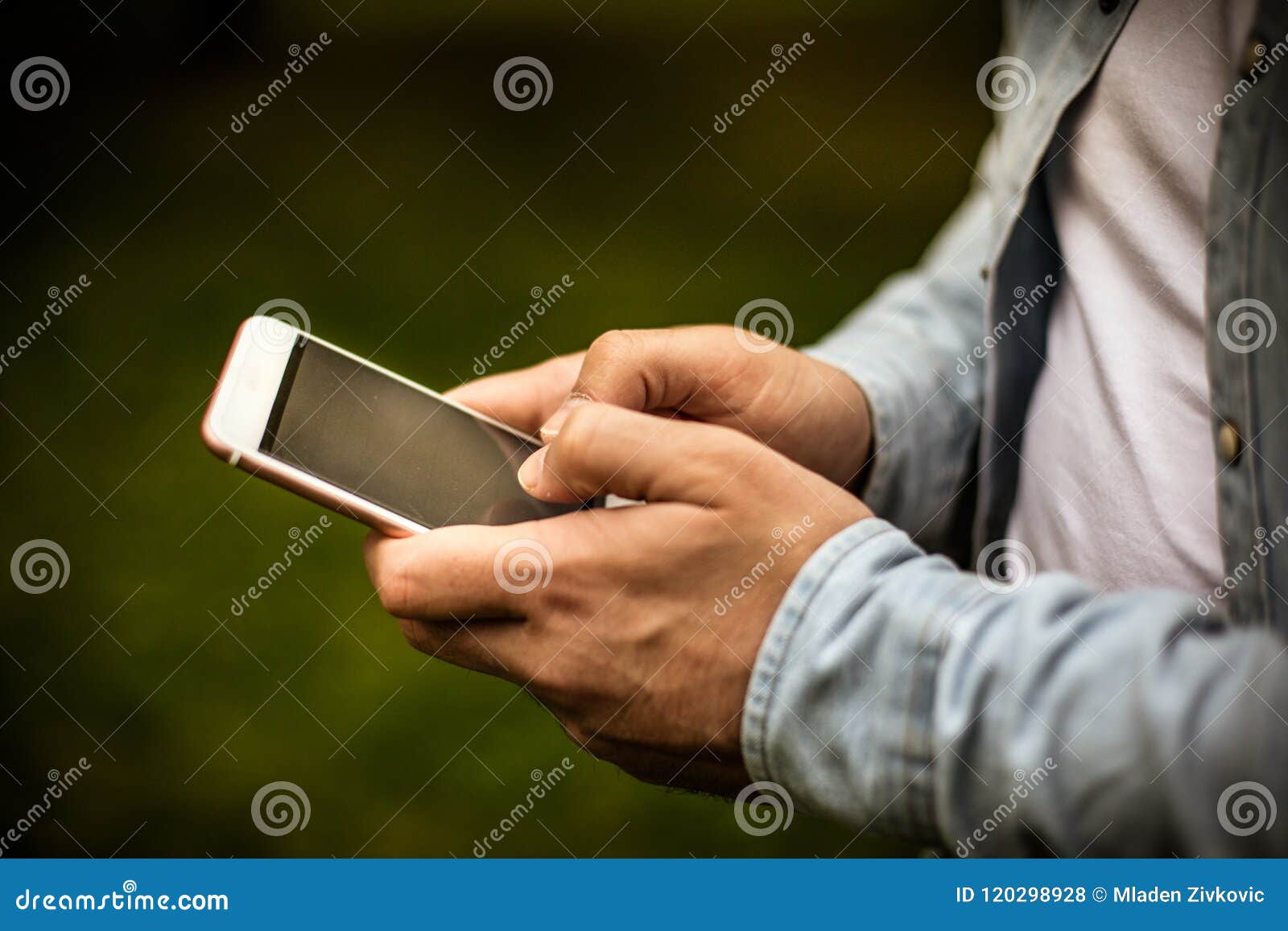 Cell phone in hands. stock photo. Image of meadow, hand - 120298928
