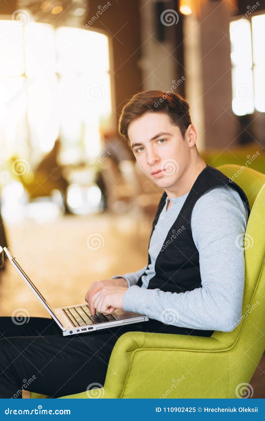 Young Man with Pc Computer Sits in a Comfortable Chair Stock Image ...