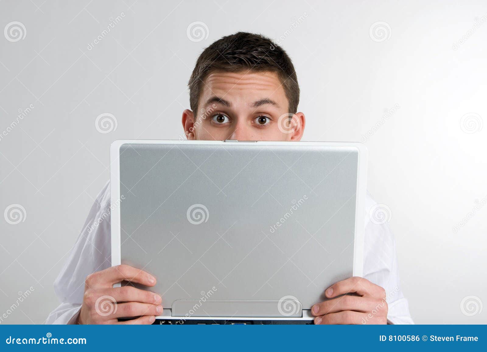 Young Man Peeking Over Laptop Computer Stock Photo - Image of holds ...