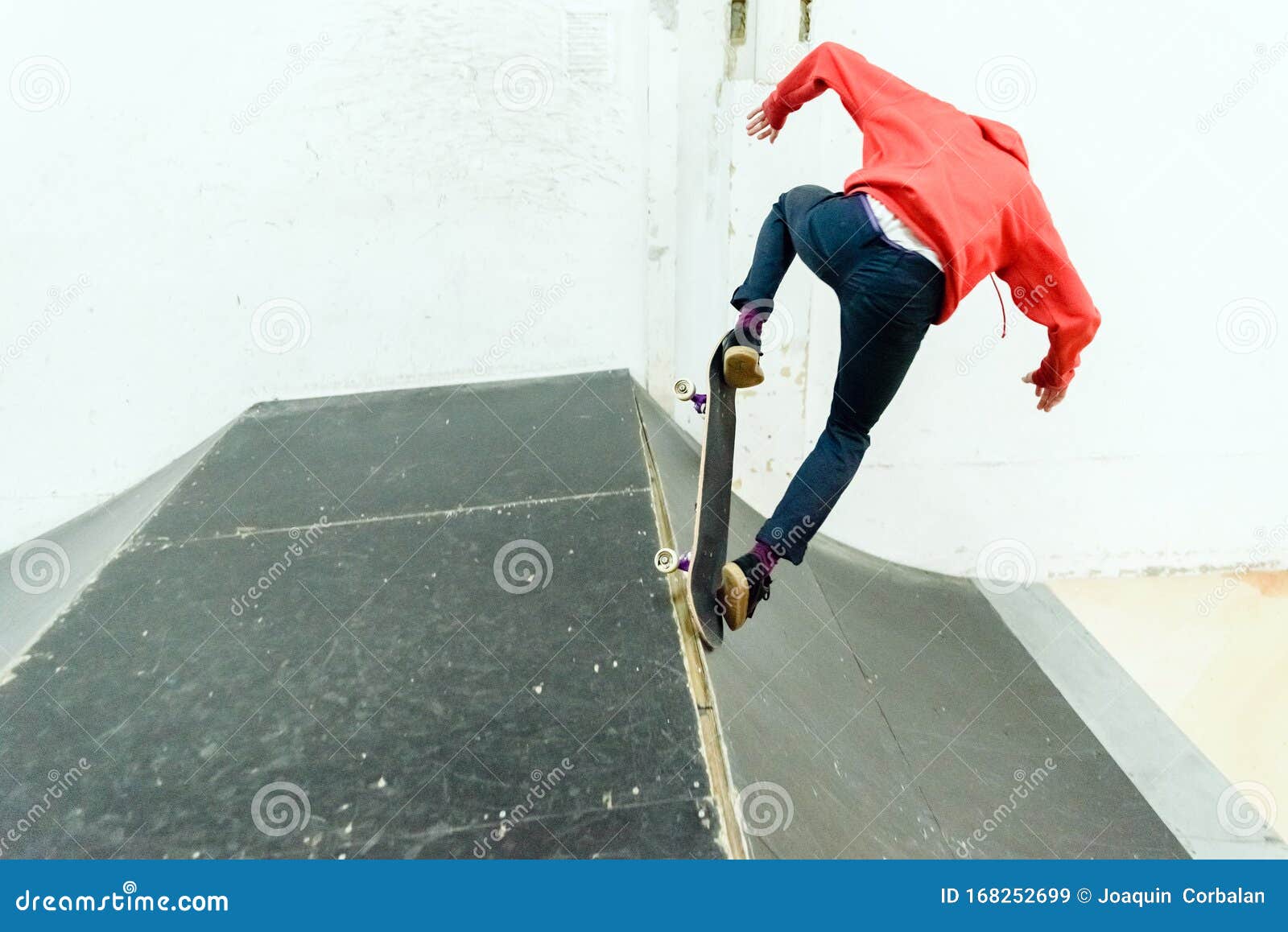 Young Man Performing Acrobatics with a Skate Indoor Stock Image - Image ...