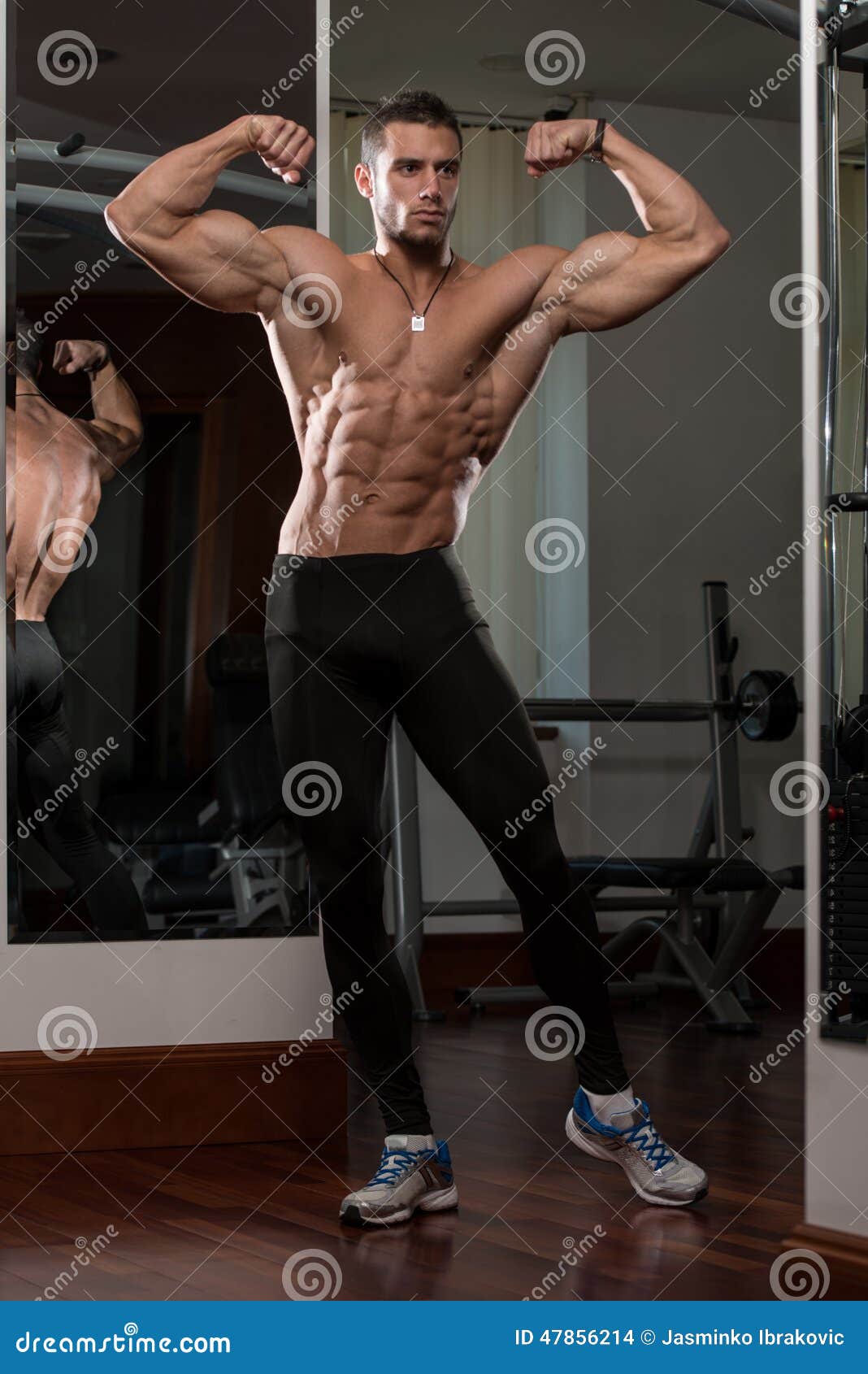 Young Man Performing Front Double Biceps Pose Stock Photo - Image of ...