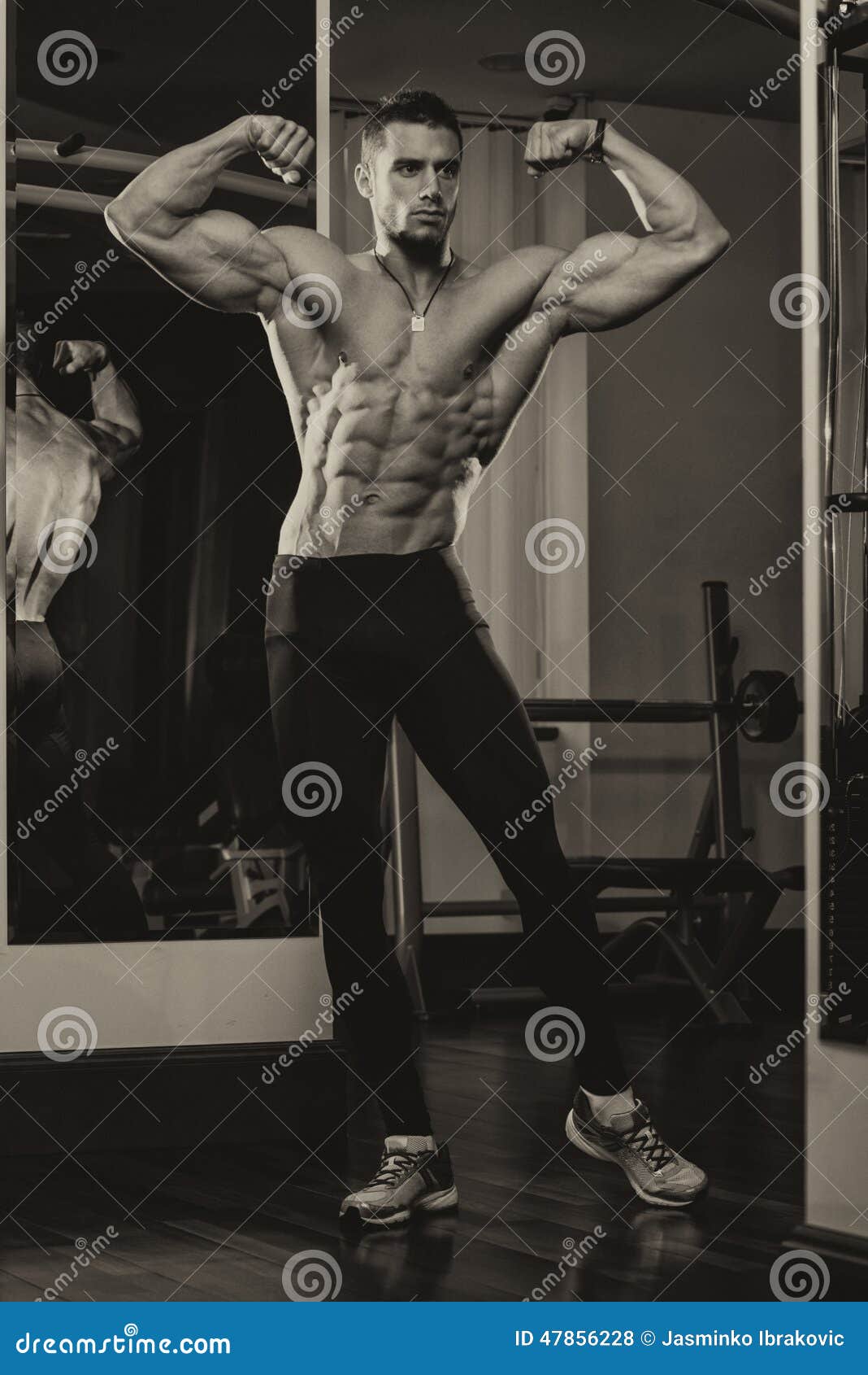 Young Man Performing Front Double Biceps Pose Stock Photo - Image of ...