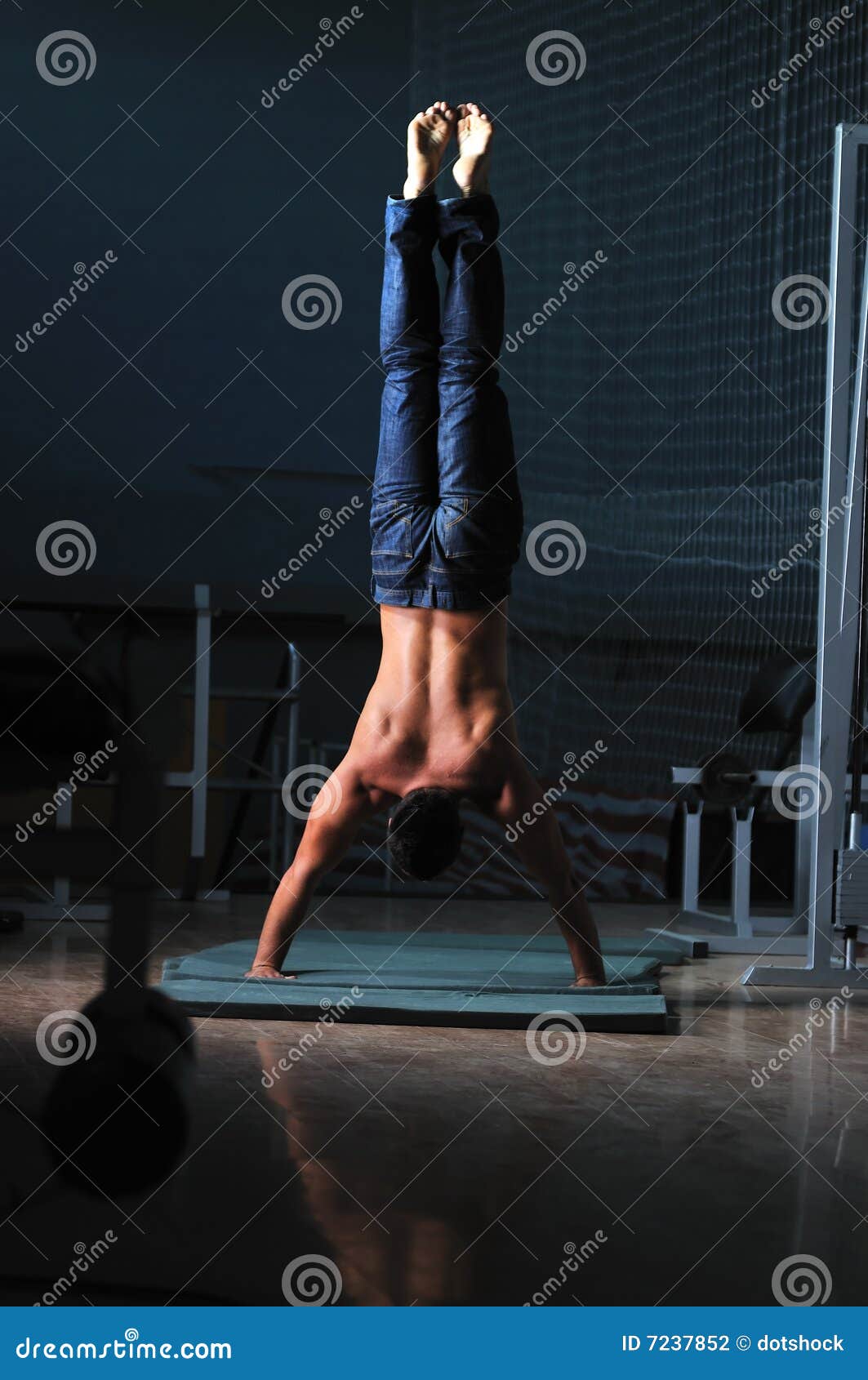Young Man Performing Handstand in Fitness Studio Stock Photo - Image of ...
