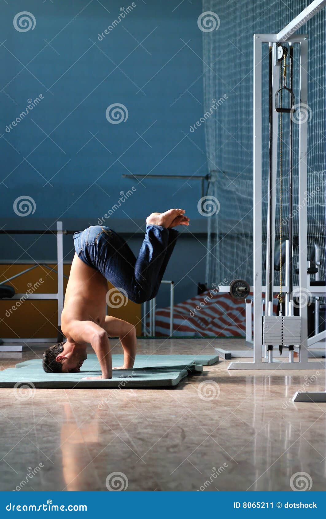 Young Man Performing Handstand in Fitness Studio Stock Image - Image of ...