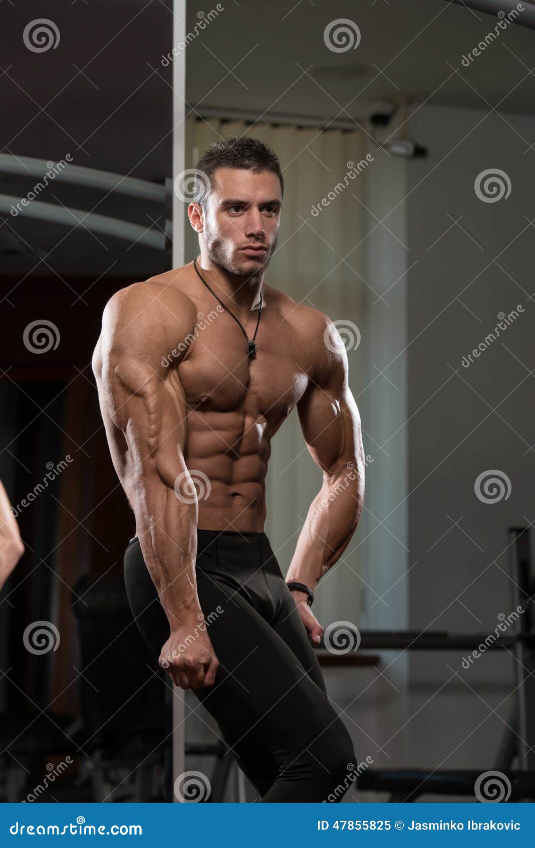 Young Man Performing Side Triceps Pose Stock Image - Image of conscious ...