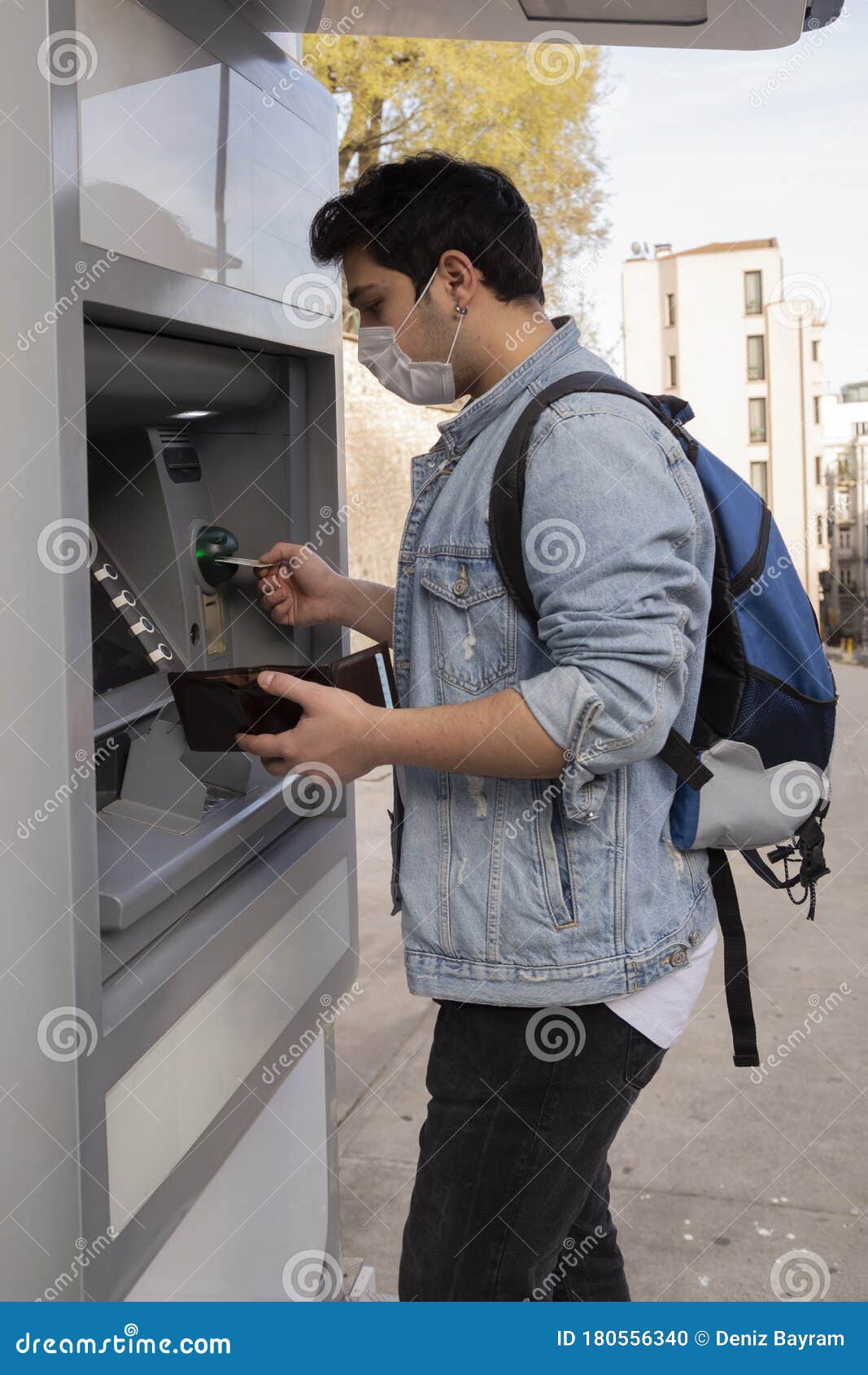 The Young Man Performs His Transactions from the Bank Atm Using His ...