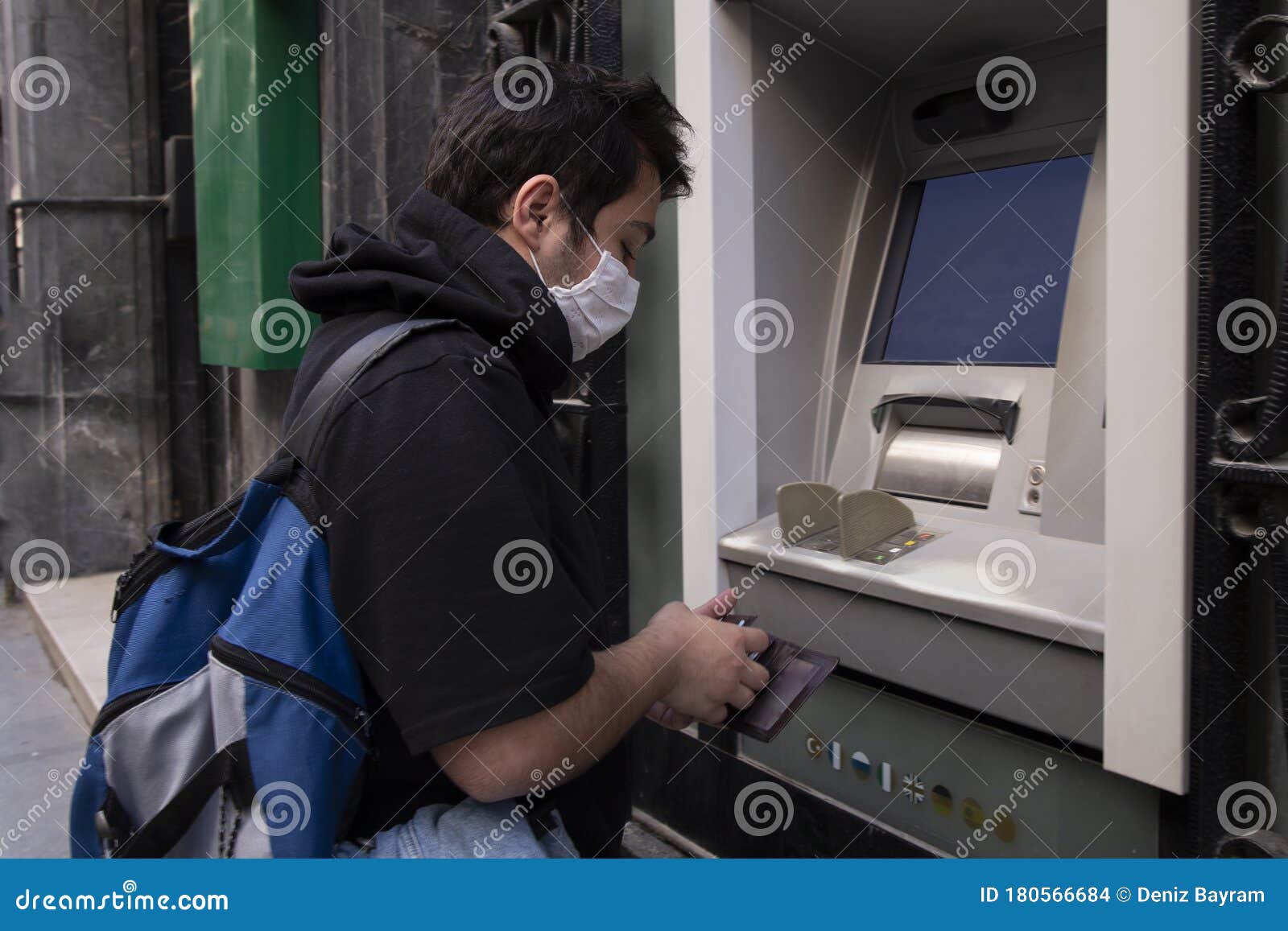 The Young Man Performs His Transactions from the Bank Atm Using His ...
