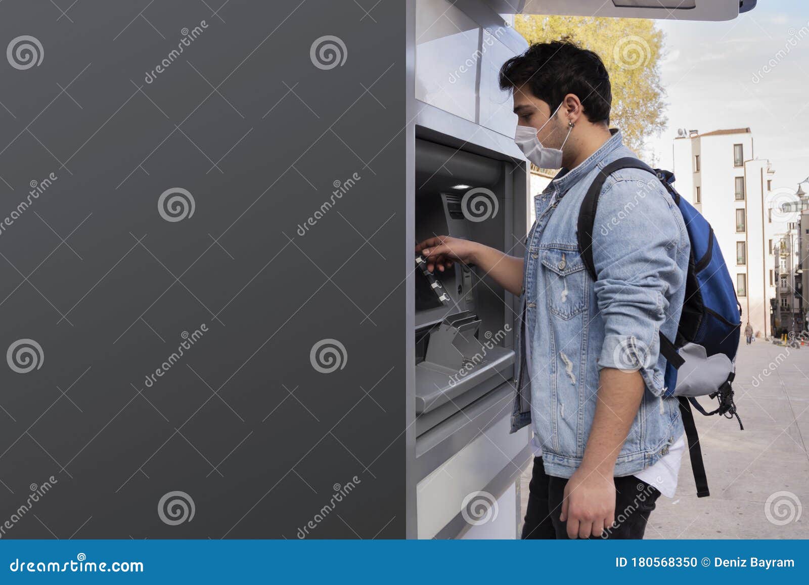 The Young Man Performs His Transactions from the Bank Atm Using His ...