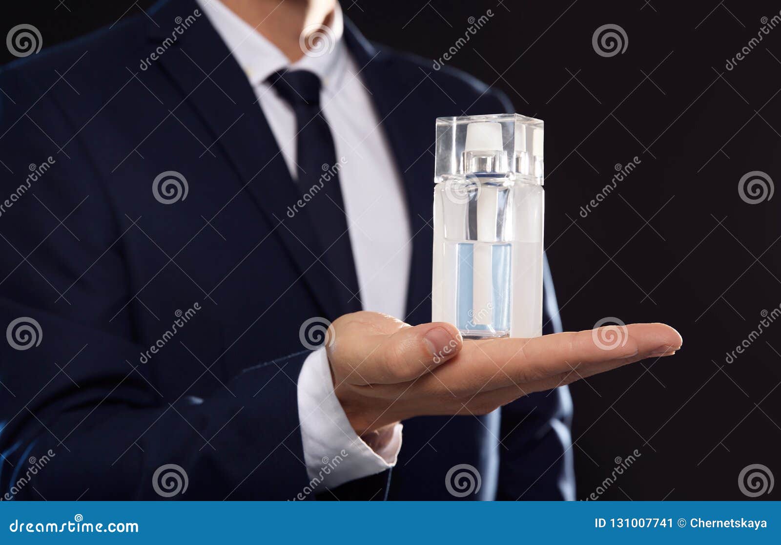 Young Man with Perfume Bottle Stock Image - Image of adult, care: 131007741