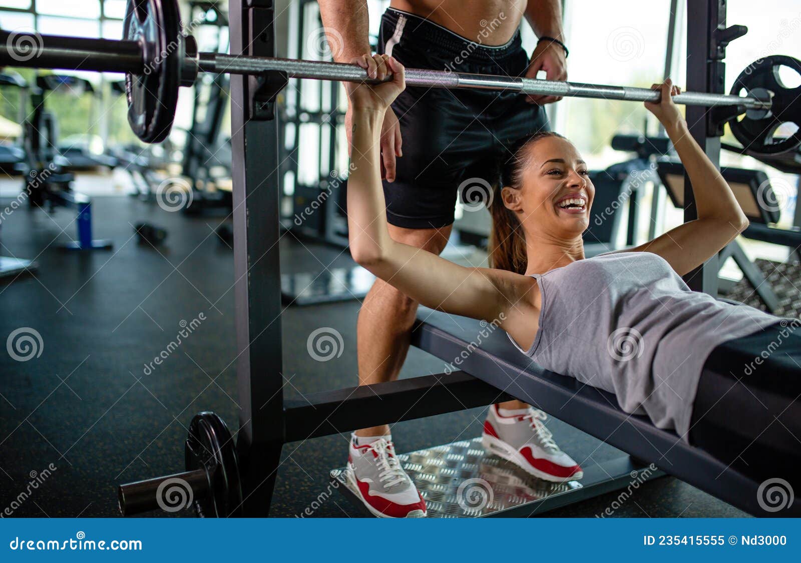 Personal Trainer Helping Woman To Working Out In Gym Healthy Lifestyle