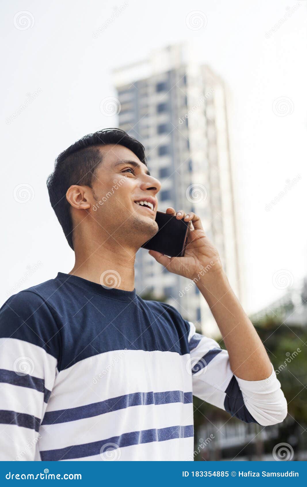 Young man on the phone stock image. Image of focus, digital - 183354885