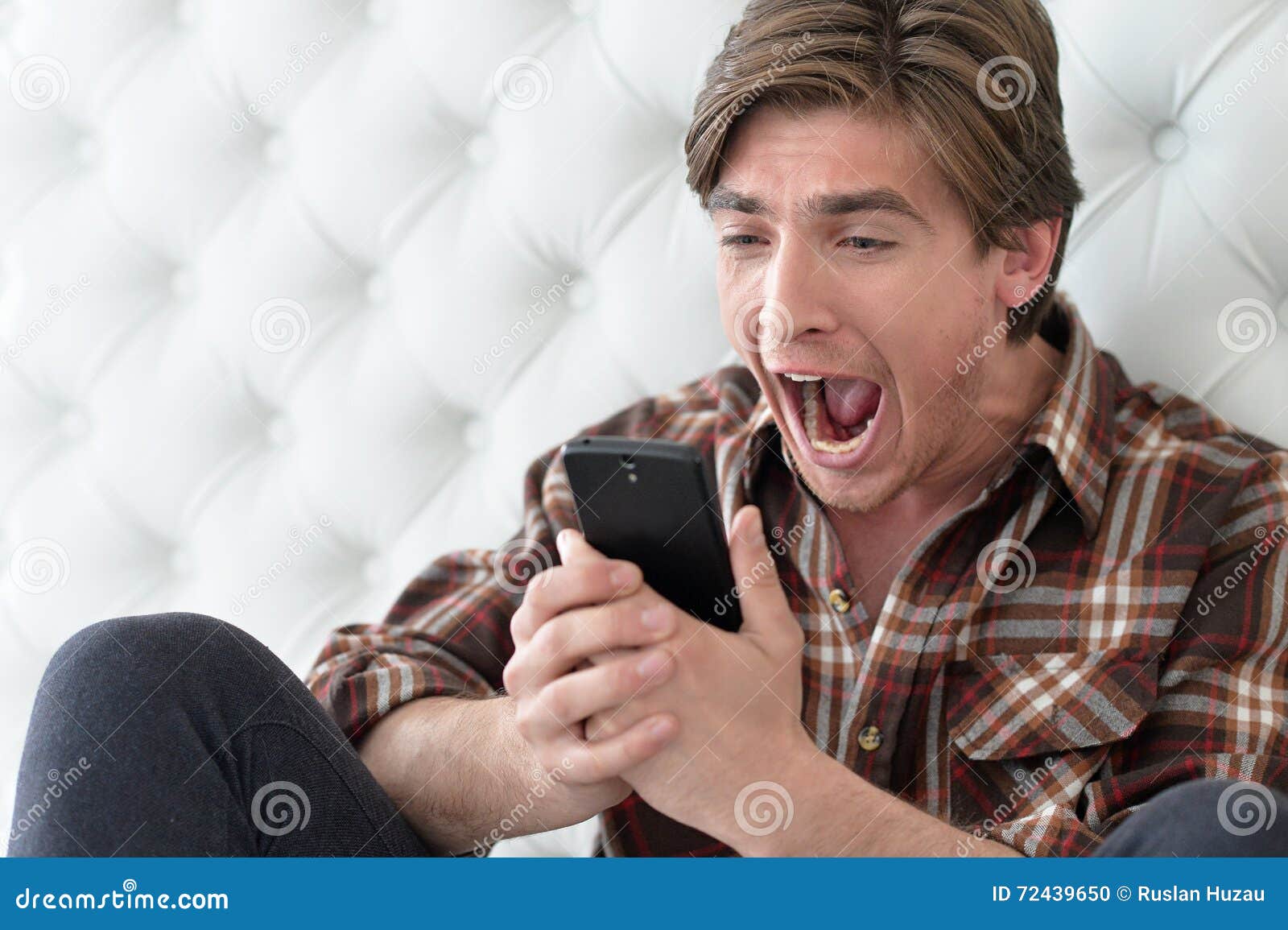 Young man with phone stock photo. Image of lifestyle - 72439650