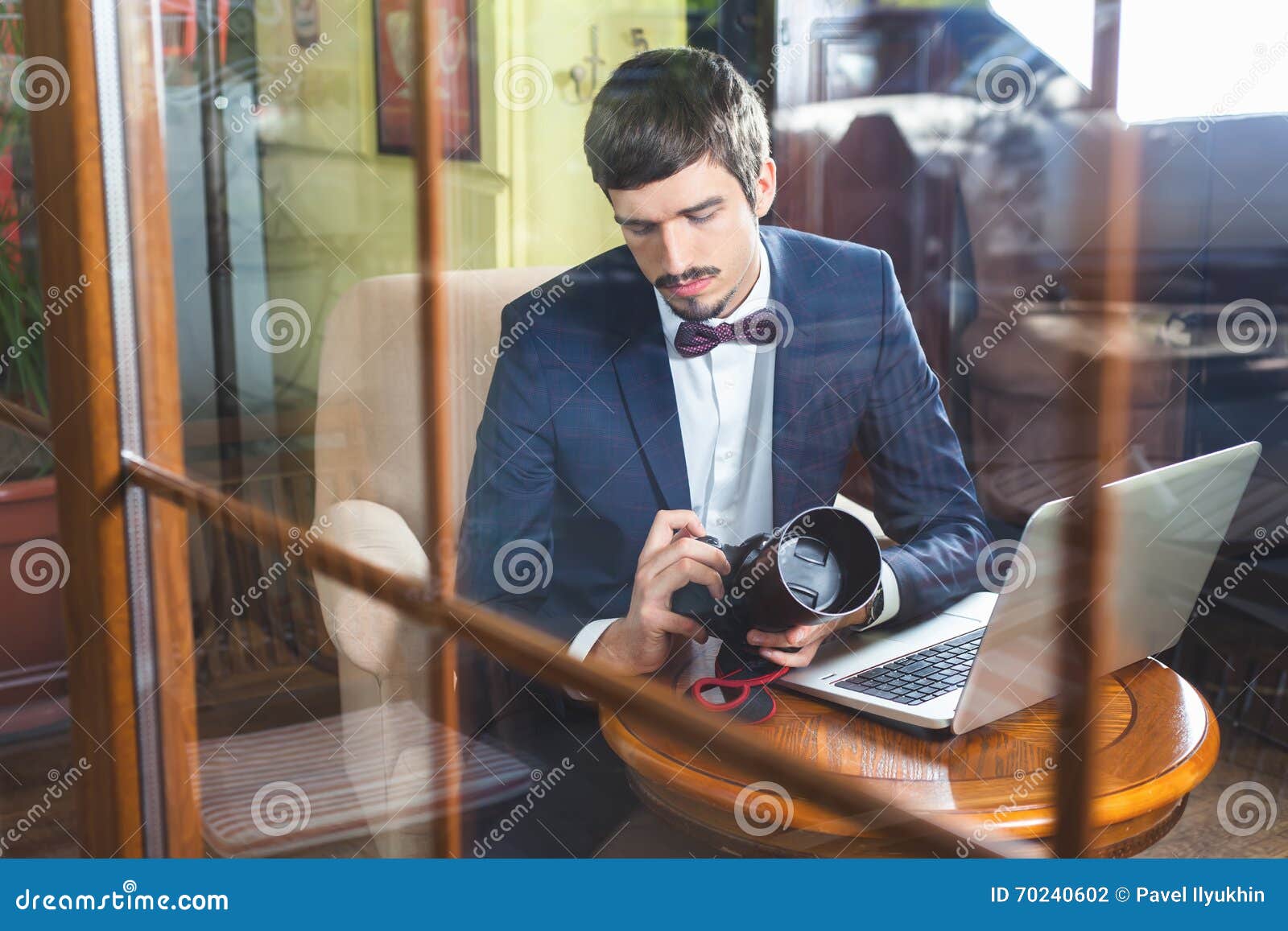Young Man Photographer Working at Cafe, Using Dslr Camera Stock Photo ...