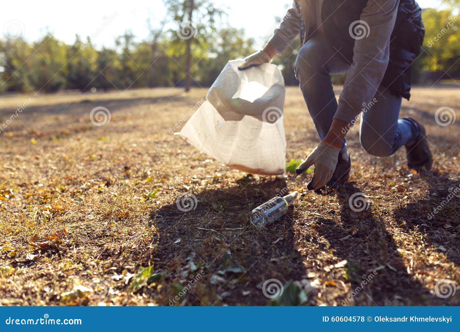 Young man picking up trash stock photo. Image of manual - 60604578 Young man picking up trash stock photo. Image of manual - 60604578
