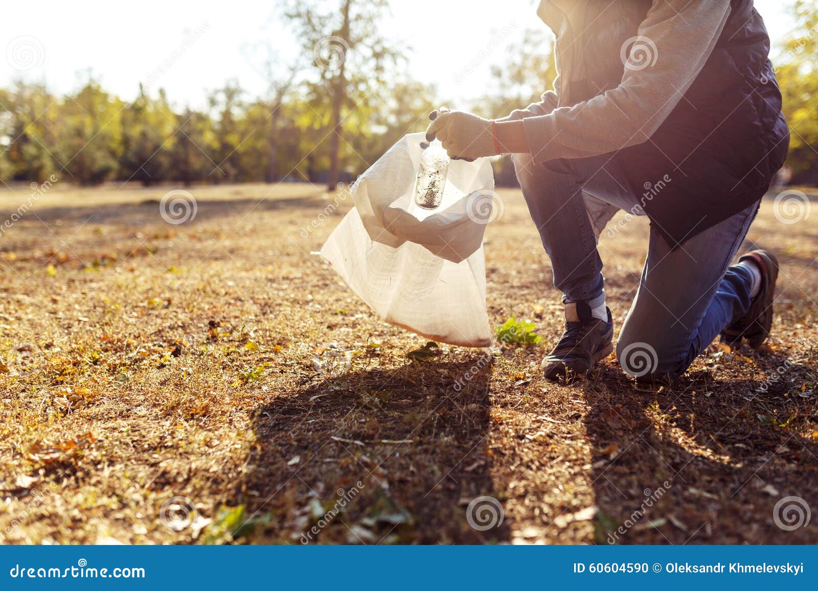 Young man picking up trash stock photo. Image of cleaning - 60604590 Young man picking up trash stock photo. Image of cleaning - 60604590
