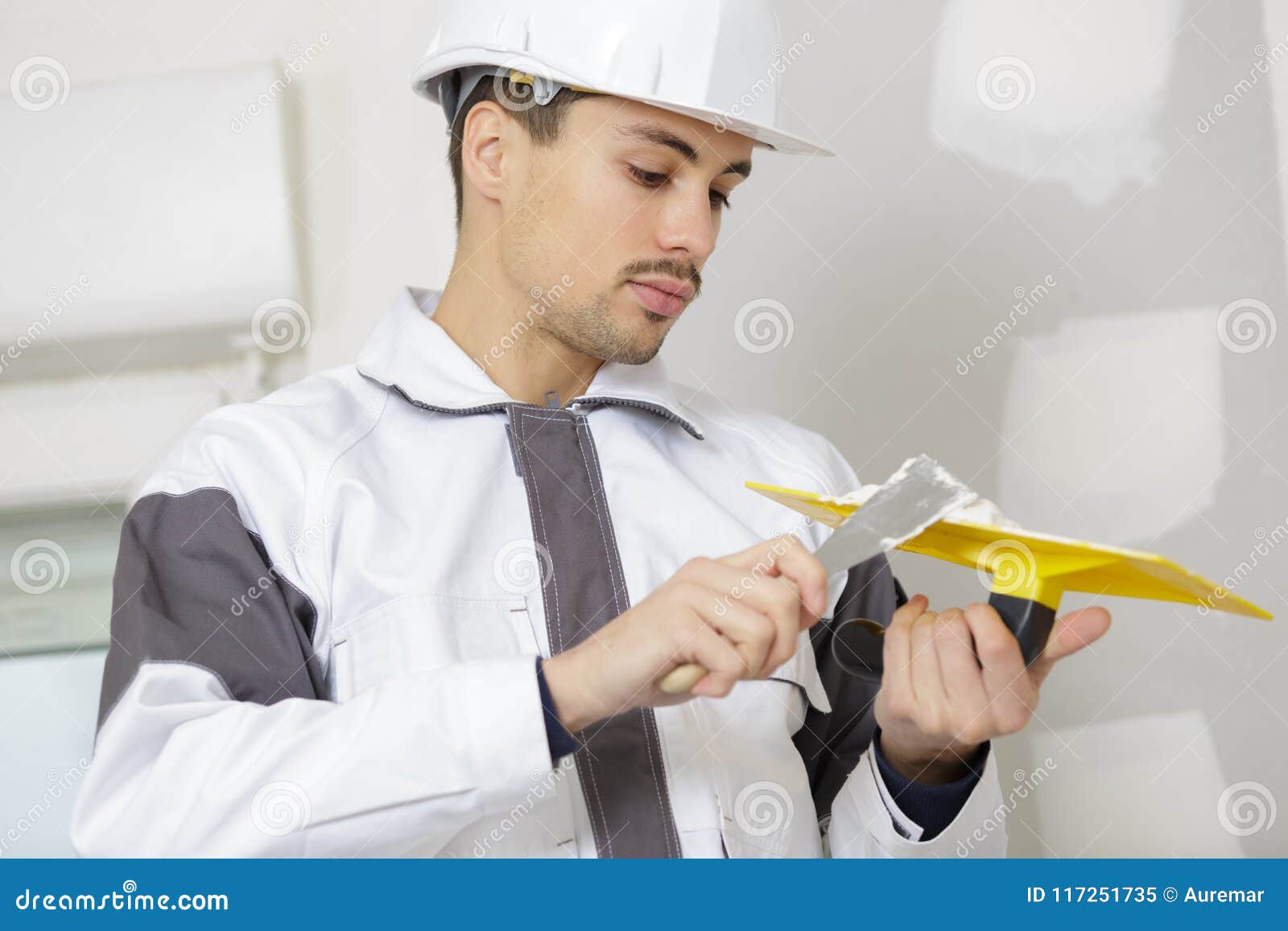 Young Man Plasterer Working on Wall in Building Construction Stock ...