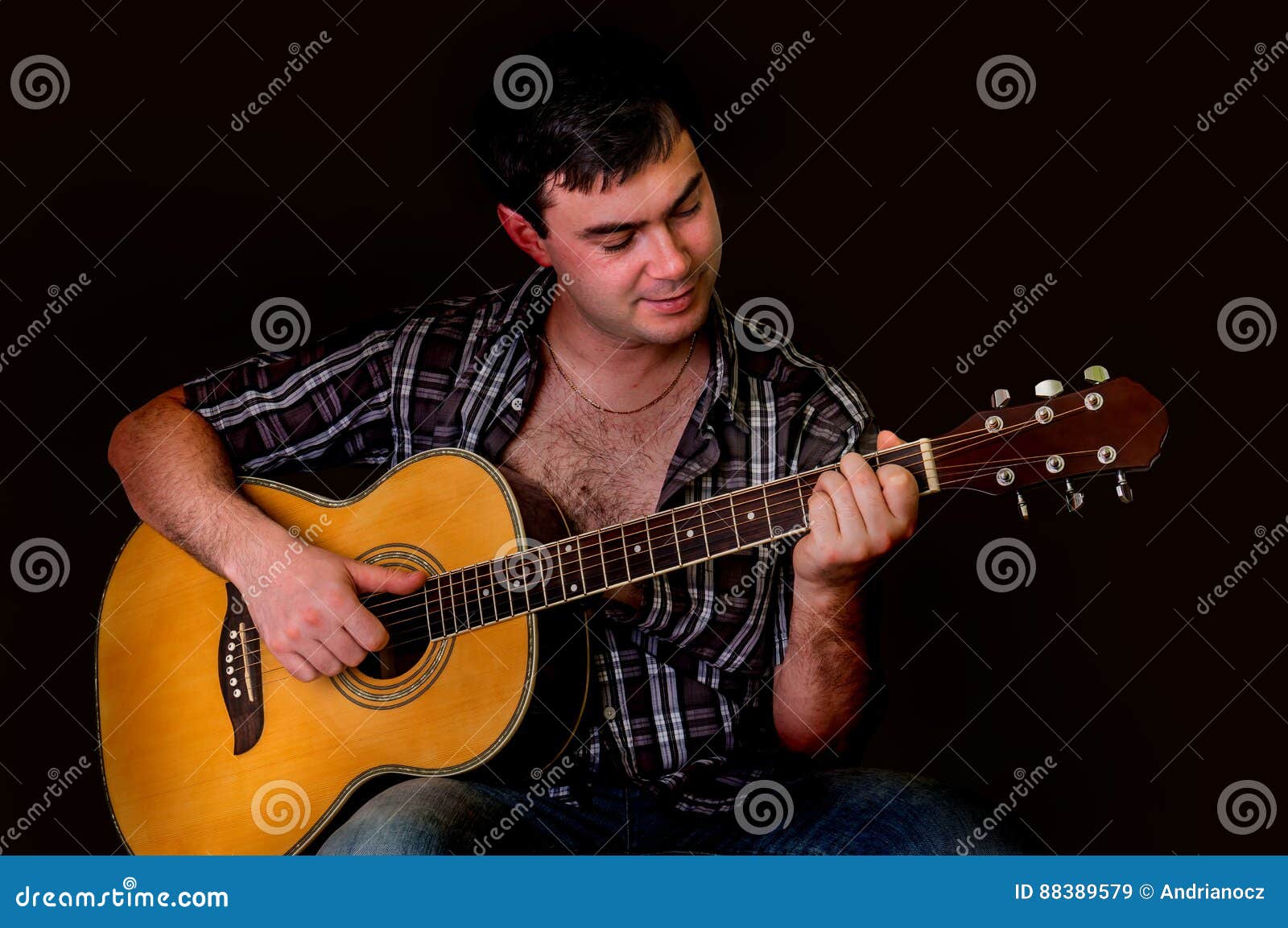 Young Man Playing Acoustic Guitar - on Black Stock Image - Image of ...
