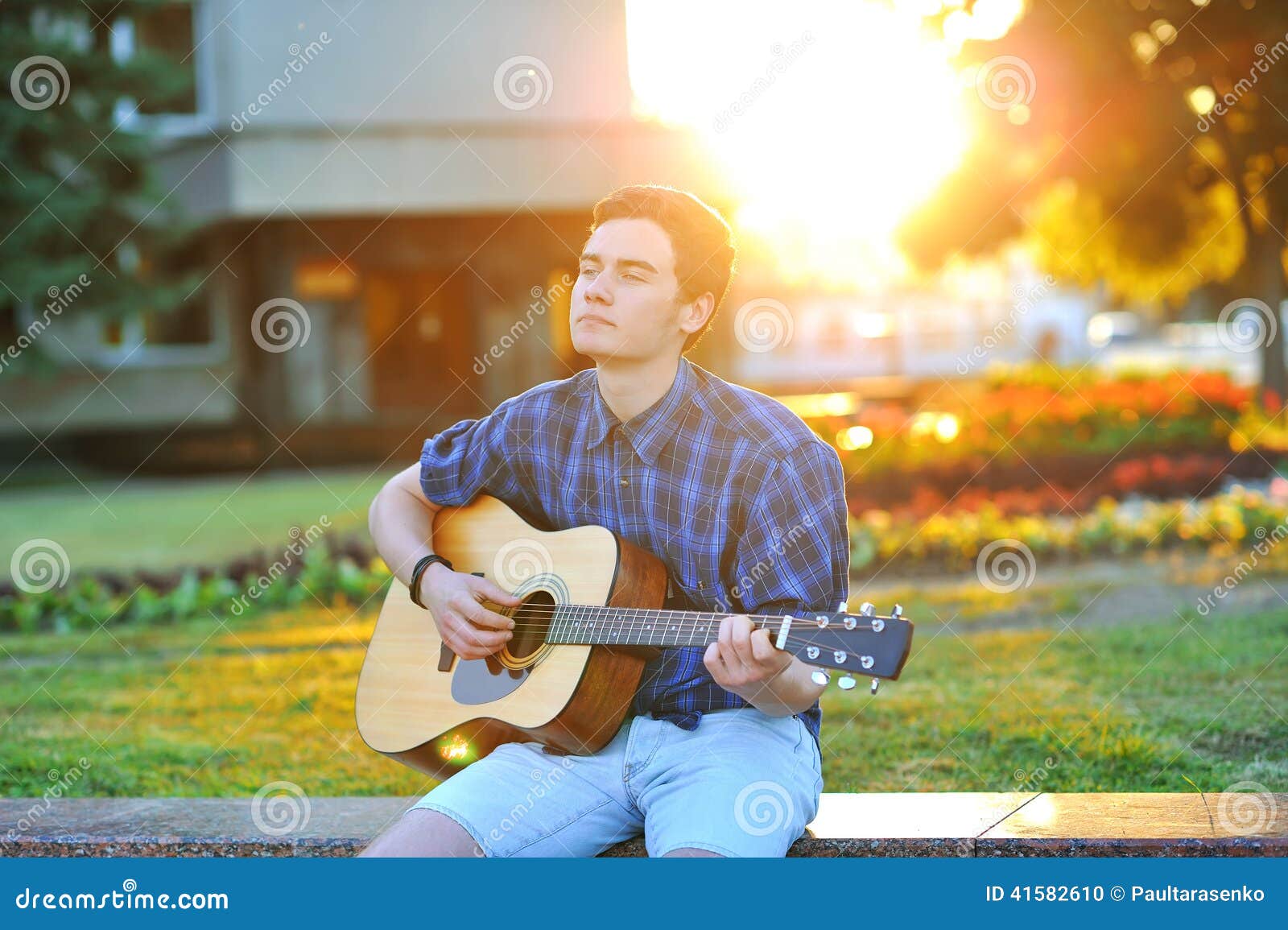 Young Man Playing on Acoustic Guitar in Park Stock Photo - Image of ...
