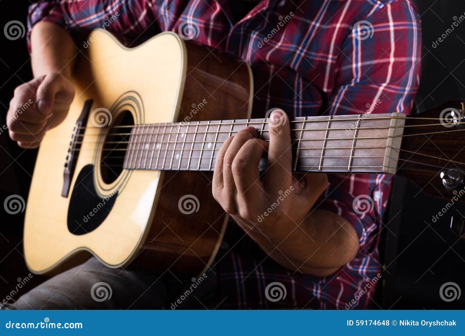Young Man Playing an Acoustic Guitar in Studio Stock Photo - Image of ...