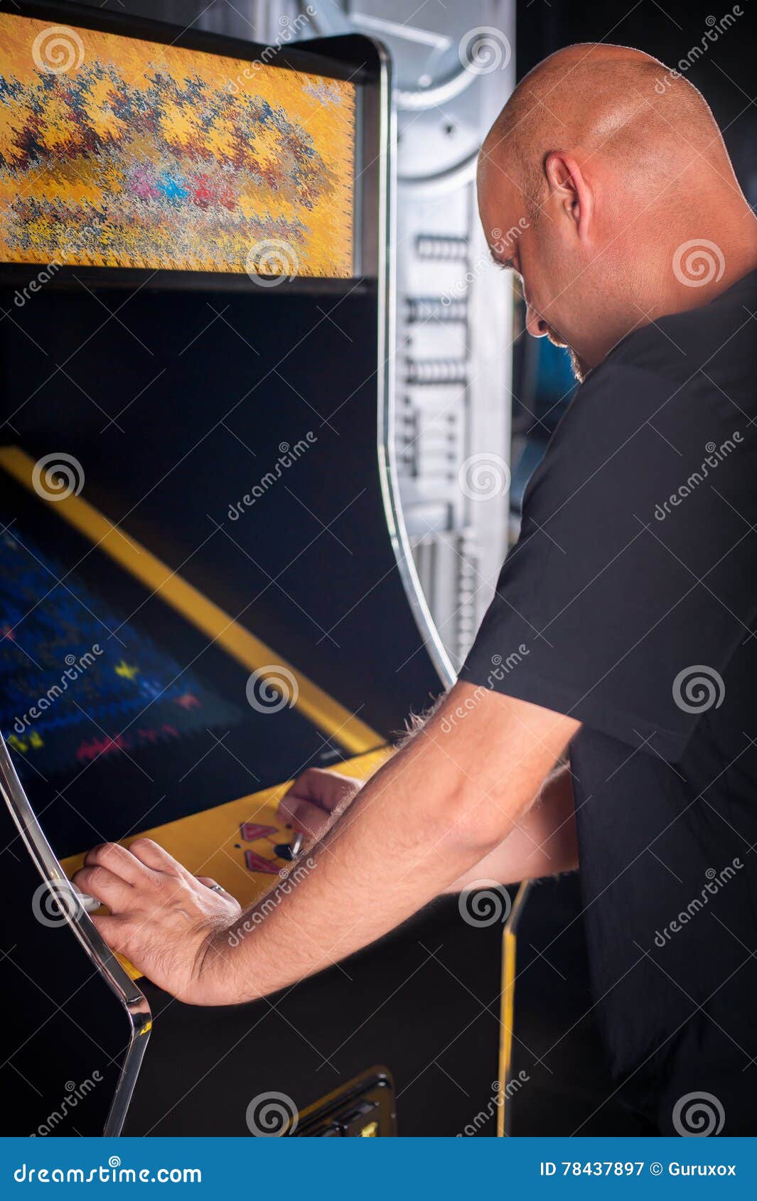 Young man playing arcade stock image. Image of games - 78437897
