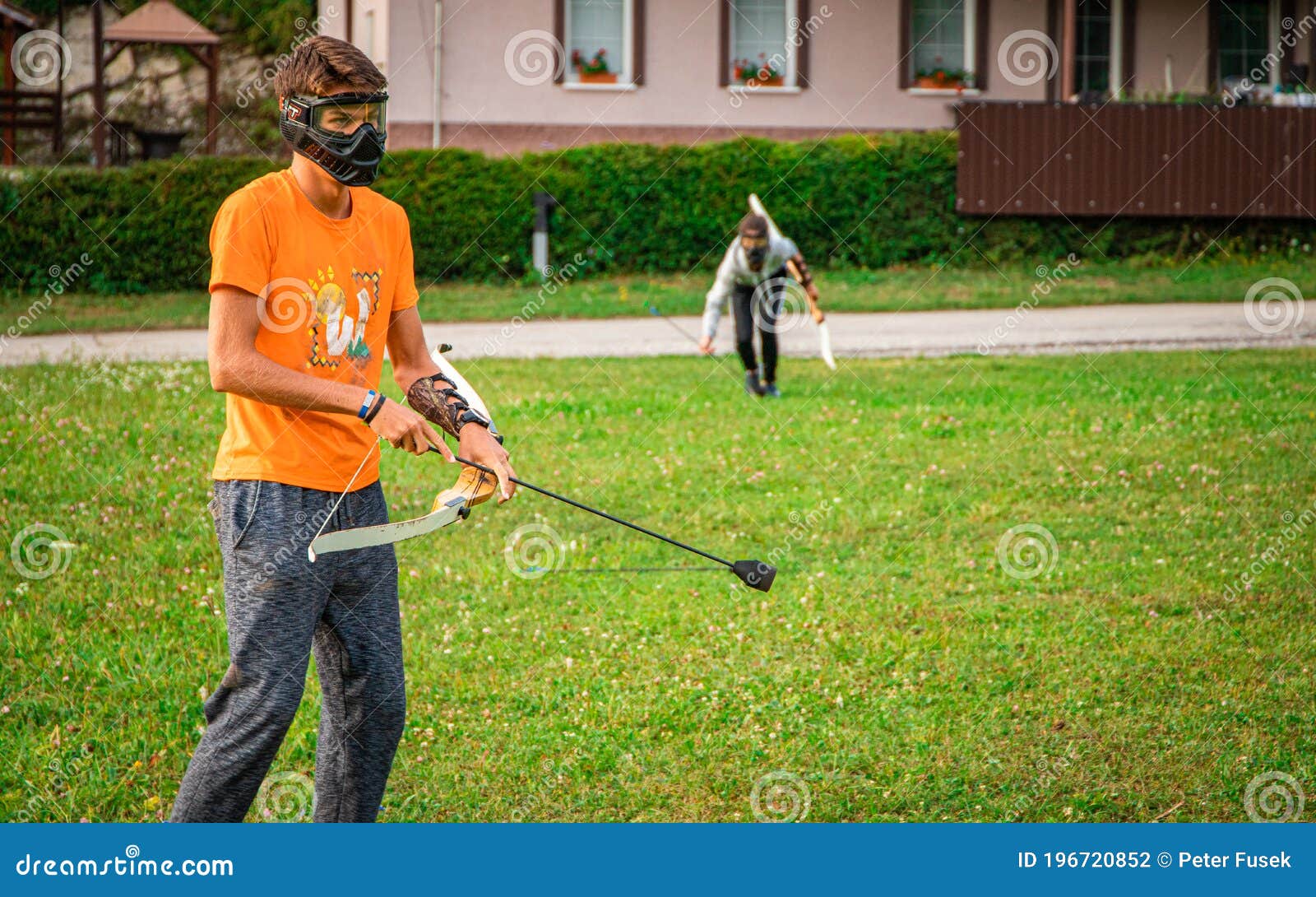 Young Man Playing Archery Tag during Summer Editorial Photography ...