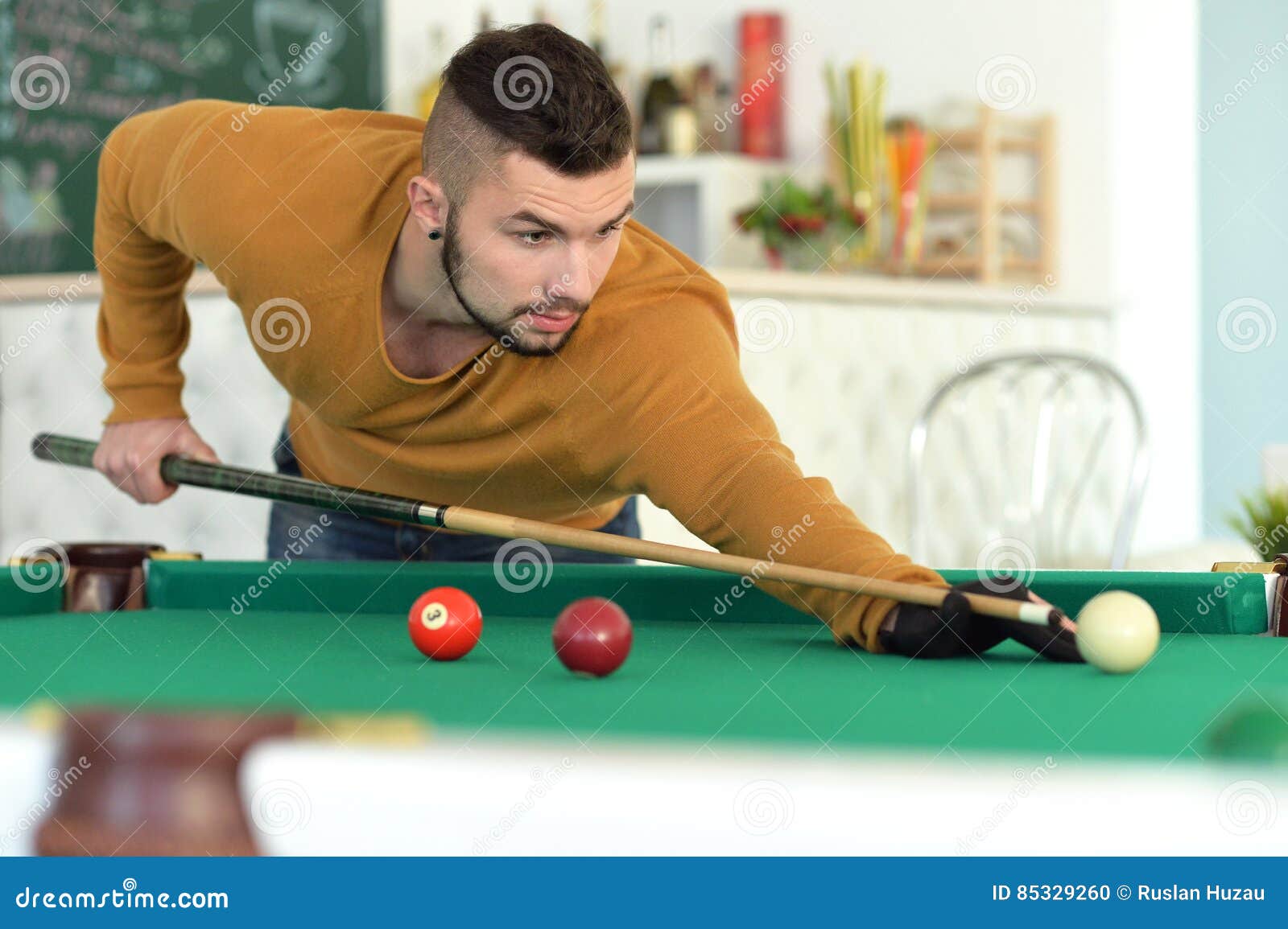 Young man playing billiard stock photo. Image of people - 85329260