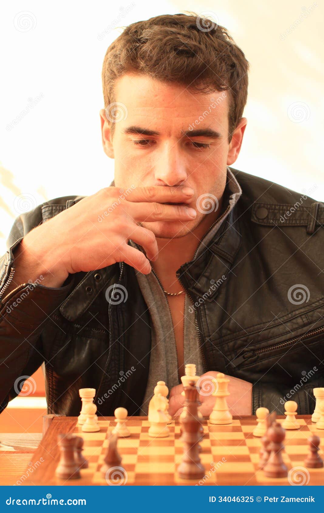Young man playing chess stock image. Image of table, young - 34046325