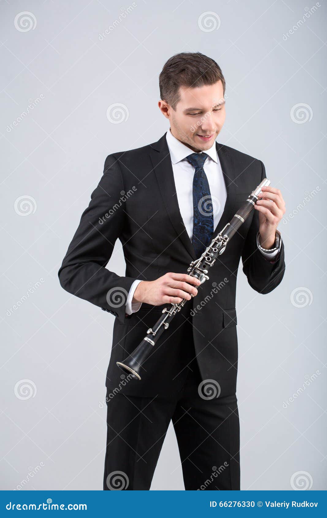 Young Man Playing the Clarinet Stock Photo - Image of closeup, indoor ...