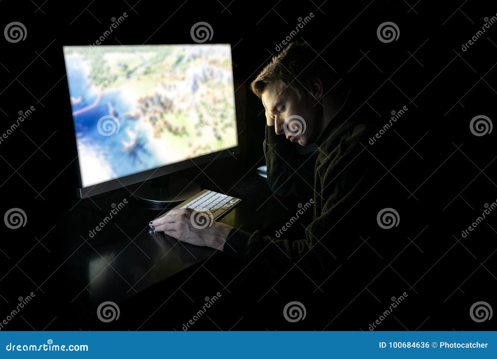 Young gamer in the dark stock photo. Image of entertainment - 100684636