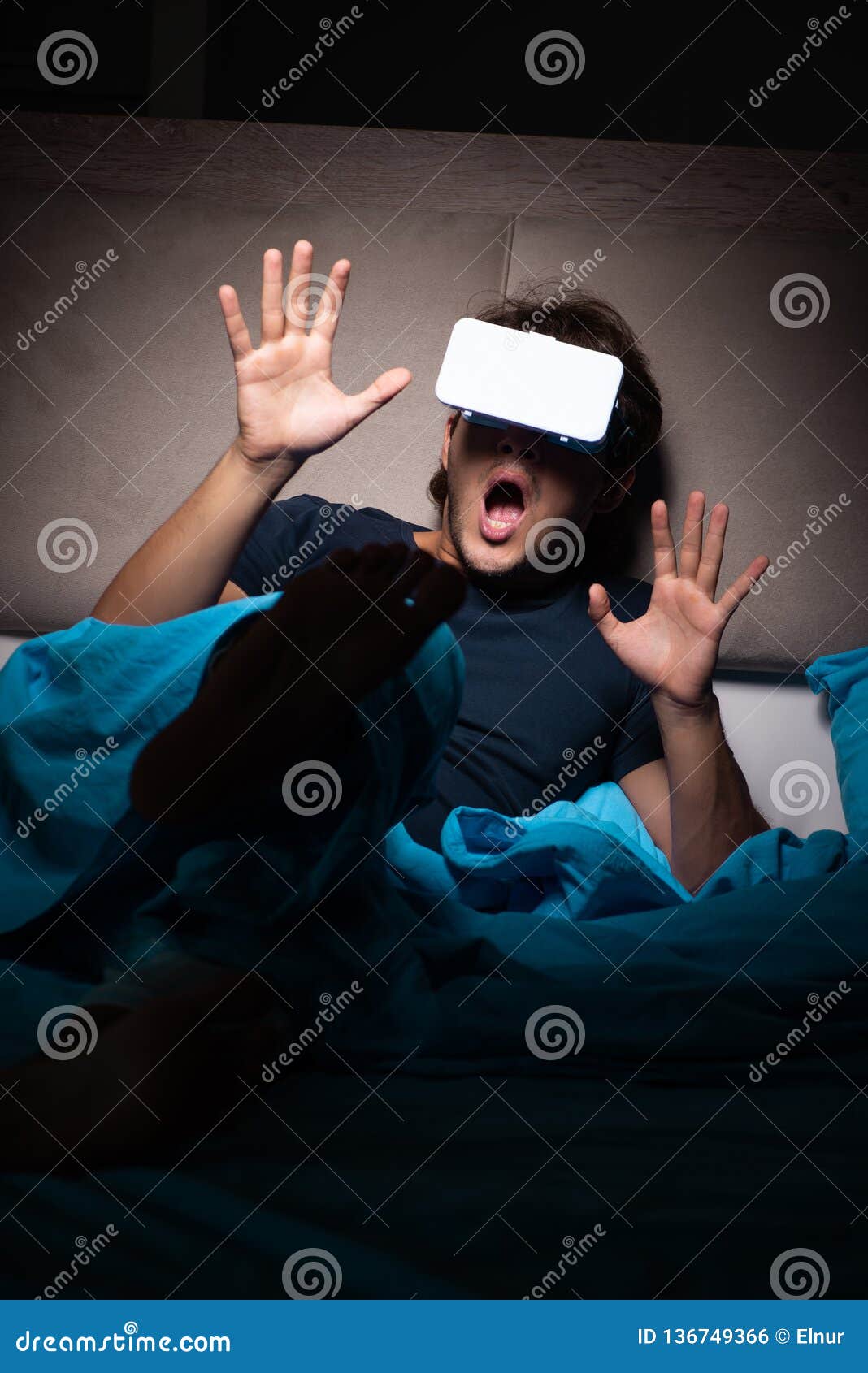 The Young Man Playing Computer Games at Night in Bed Stock Photo ...
