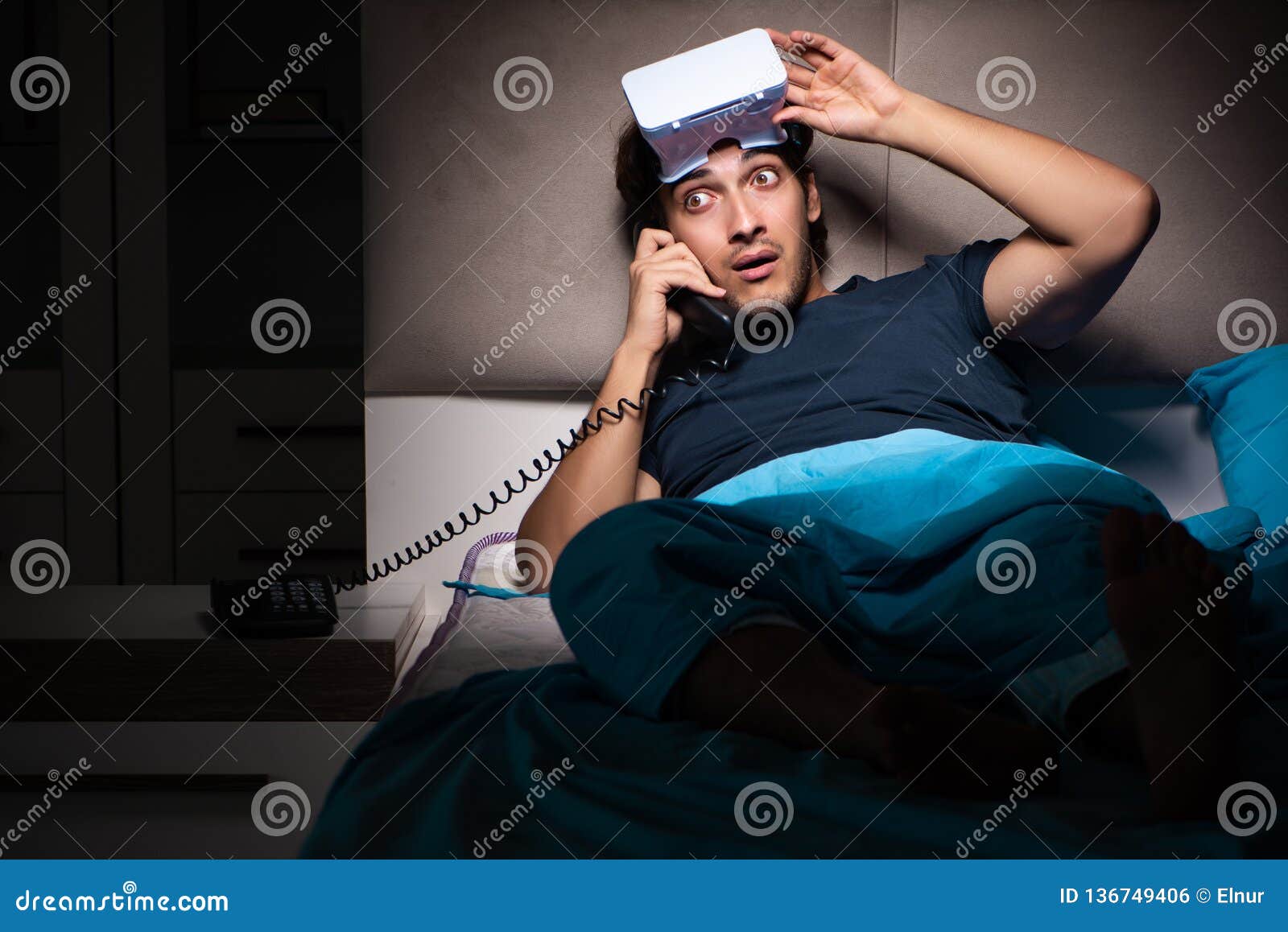 The Young Man Playing Computer Games at Night in Bed Stock Photo ...