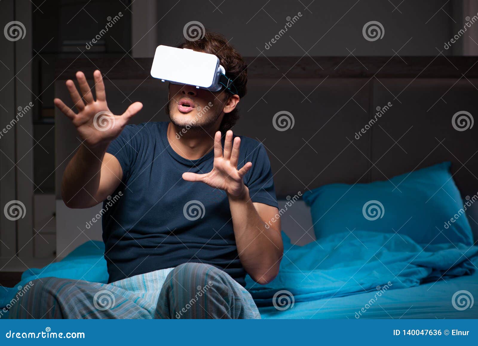 The Young Man Playing Computer Games at Night in Bed Stock Photo ...