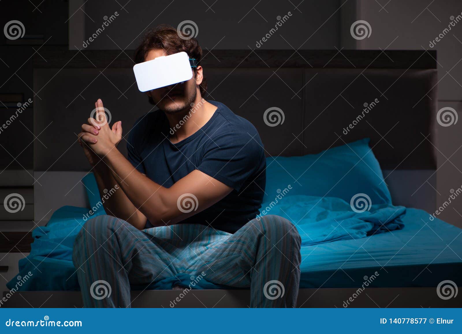 The Young Man Playing Computer Games at Night in Bed Stock Image ...