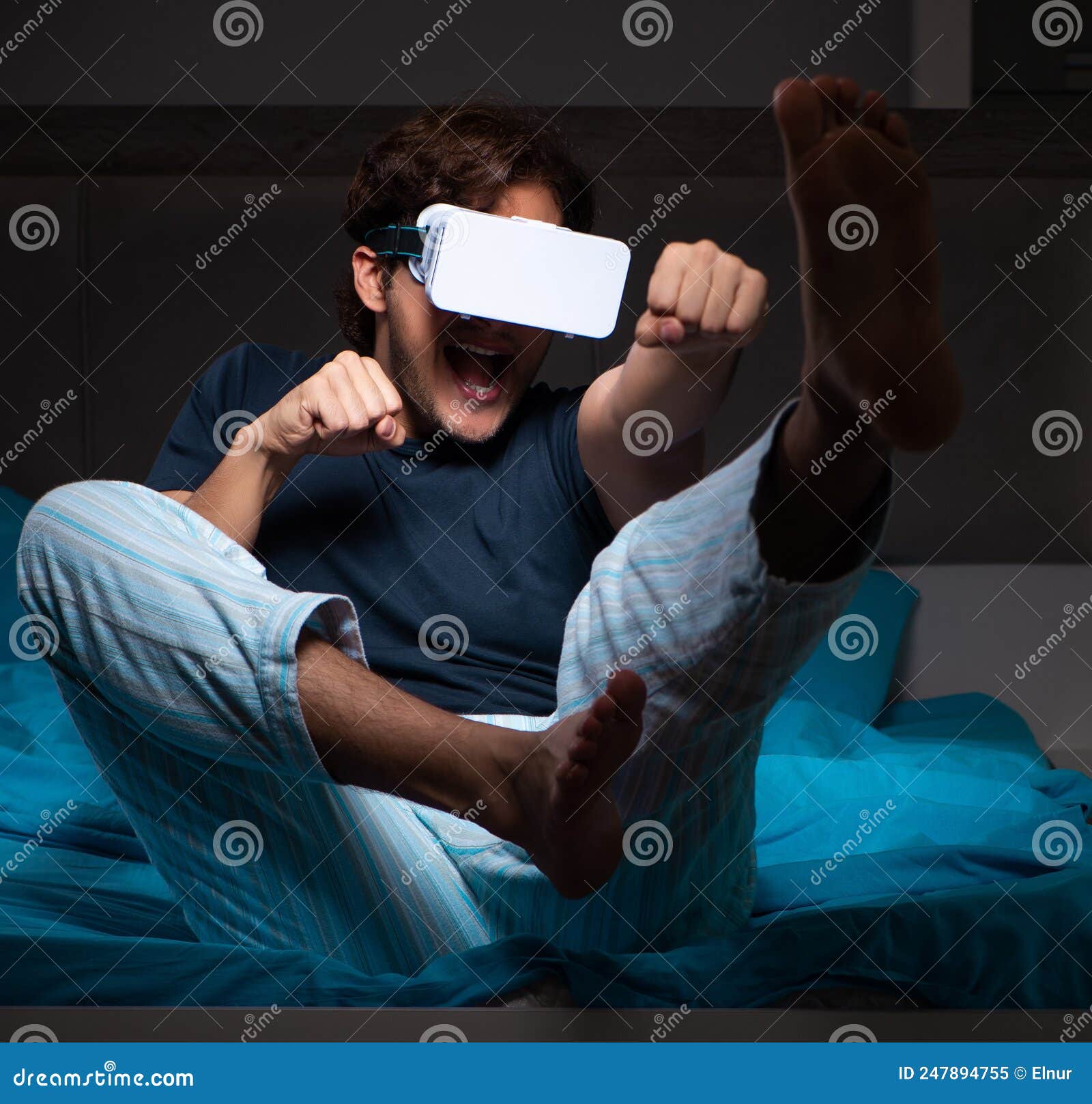 Young Man Playing Computer Games at Night in Bed Stock Image - Image of ...