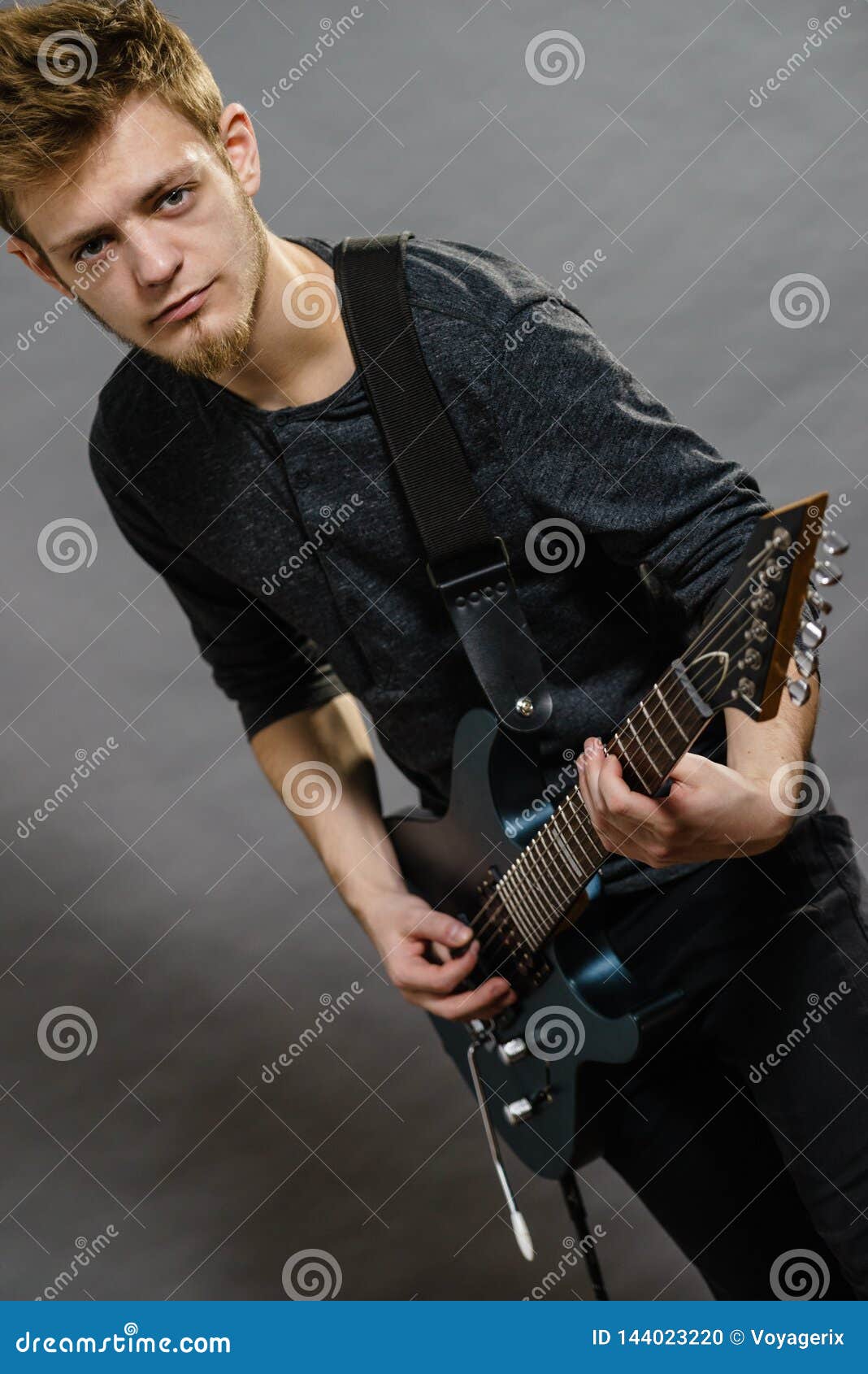 Young Man Playing Electric Guitar Stock Photo - Image of strumming ... Young Man Playing Electric Guitar Stock Photo - Image of strumming ...