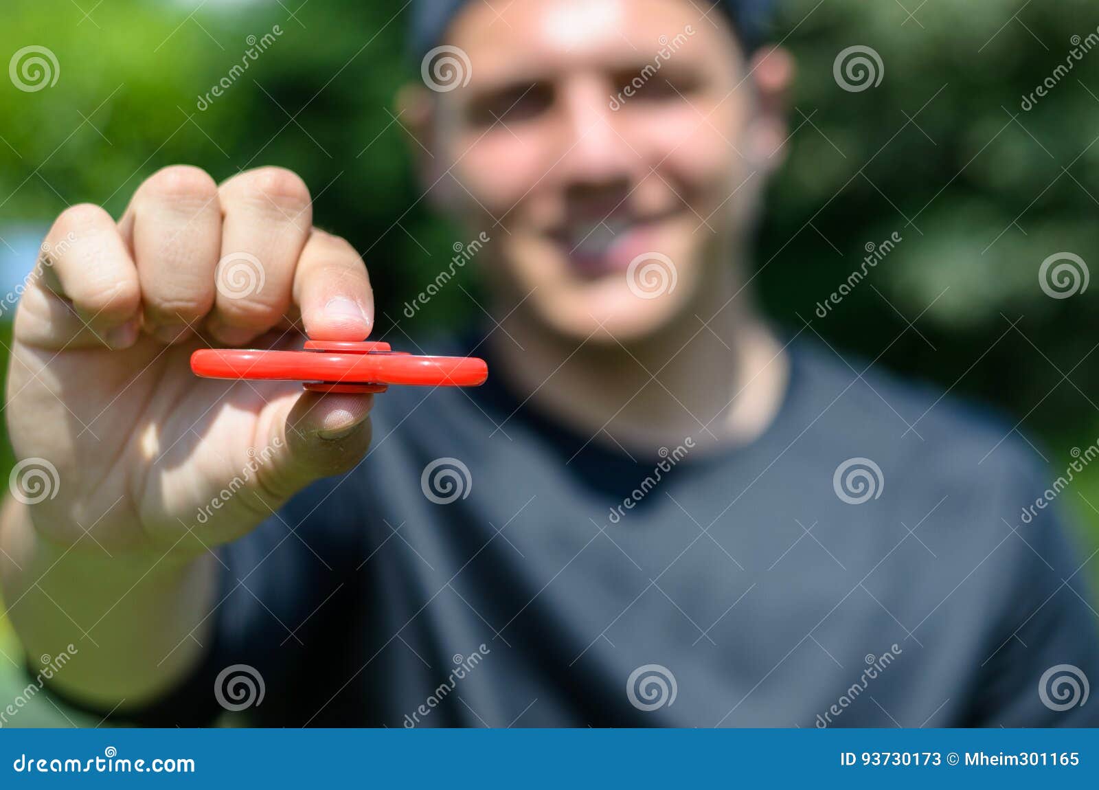 Young Man Playing with a Fidget Spinner Stock Image - Image of energy ...