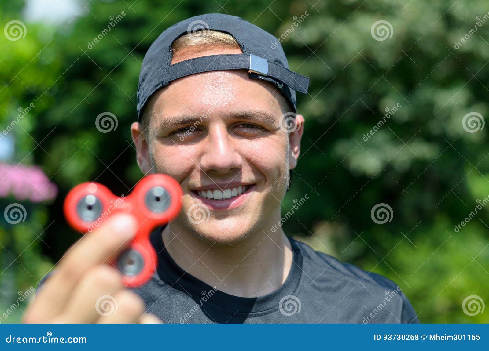 Young Man Playing with a Fidget Spinner Stock Photo - Image of fidget ...