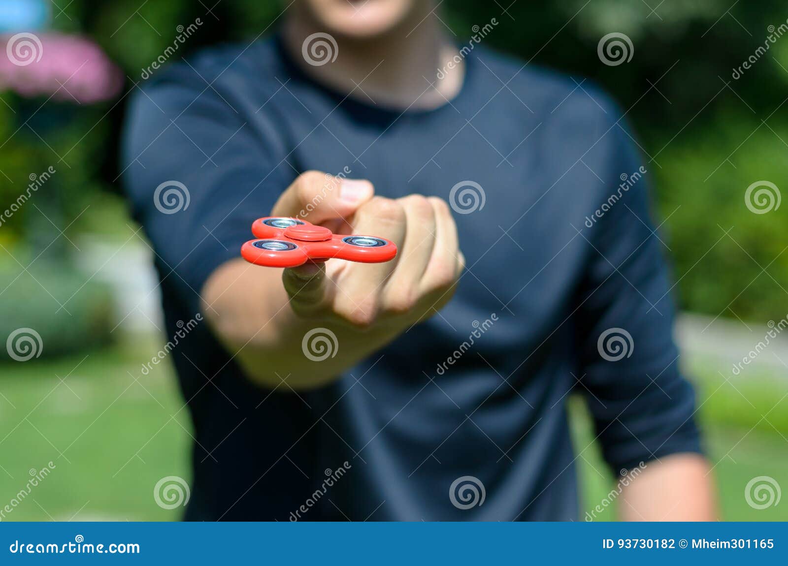 Young Man Playing with a Fidget Spinner Stock Photo - Image of training ...