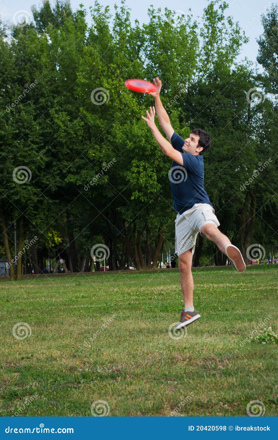 Young Man Playing Frisbee Outdoors Stock Photo - Image of grass ...