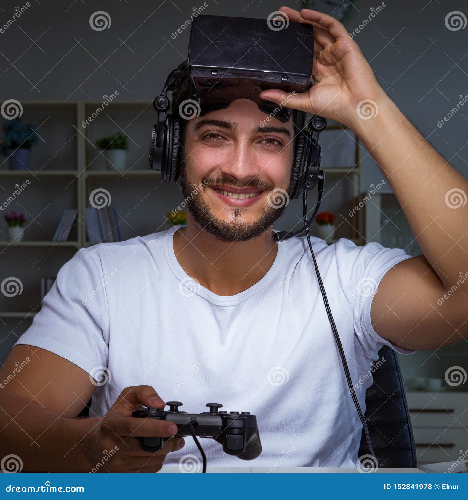 Young Man Playing Games Long Hours Late in the Office Stock Photo ...