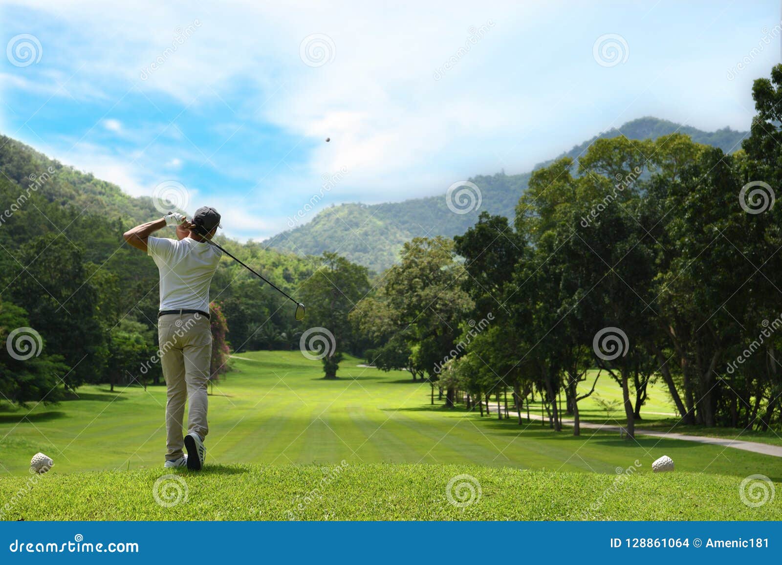 Young Man Playing Golf on a Beautiful Natural Golf Course Stock Photo ...