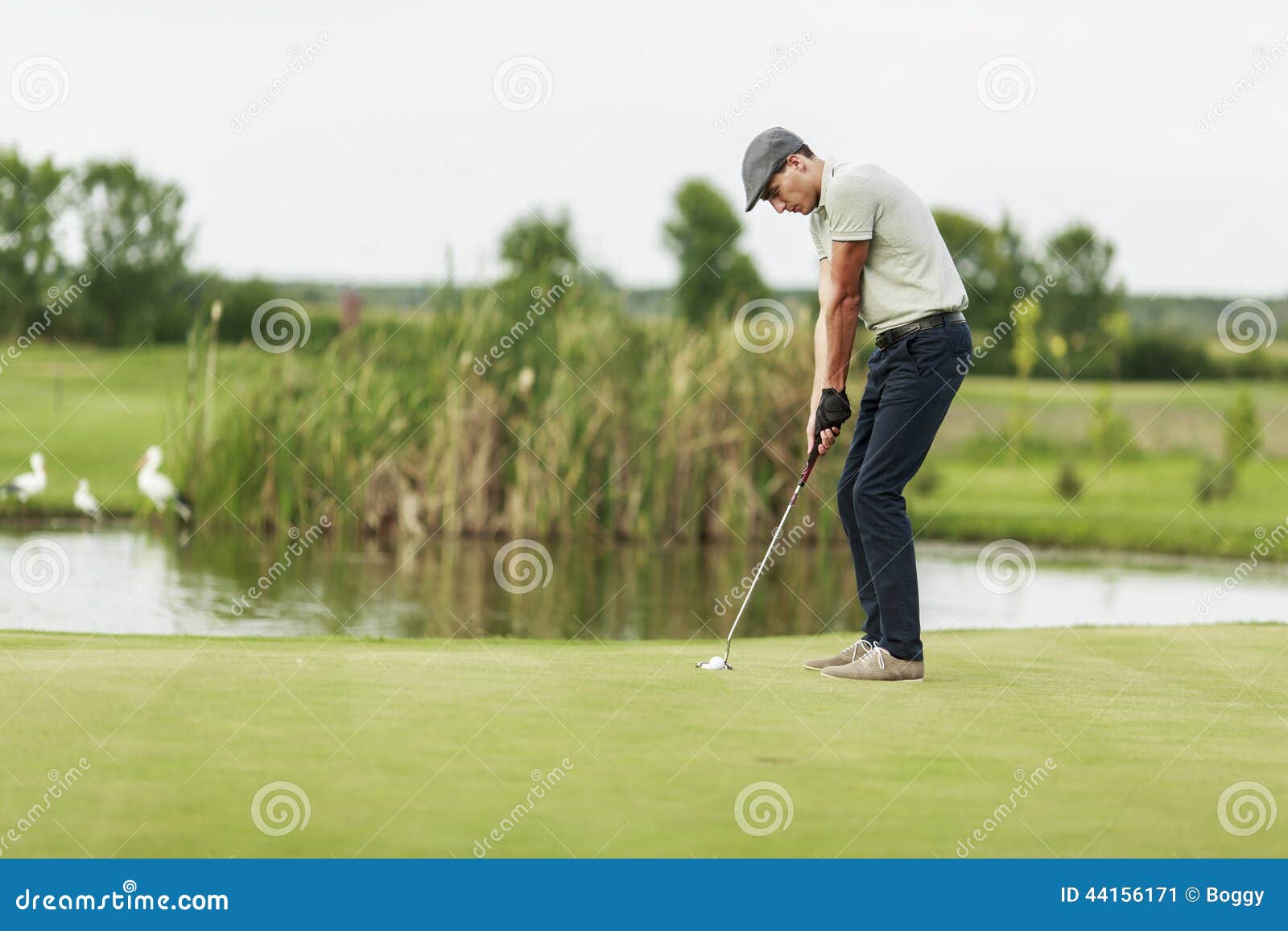 Young man playing golf stock image. Image of player, club - 44156171