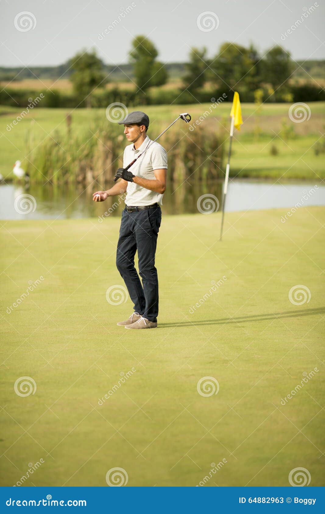 Young man playing golf stock image. Image of competition - 64882963