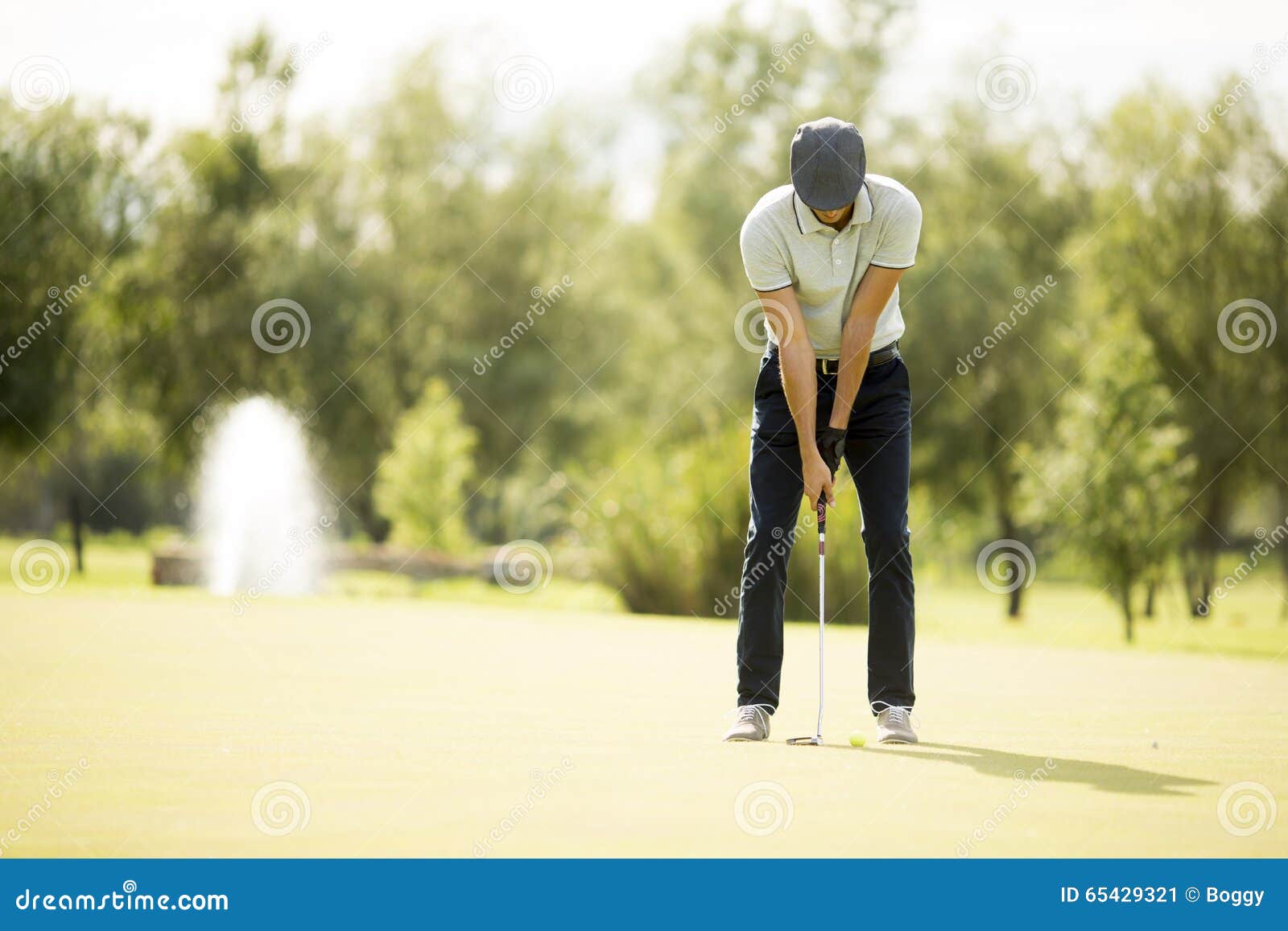Young man playing golf stock image. Image of game, people - 65429321