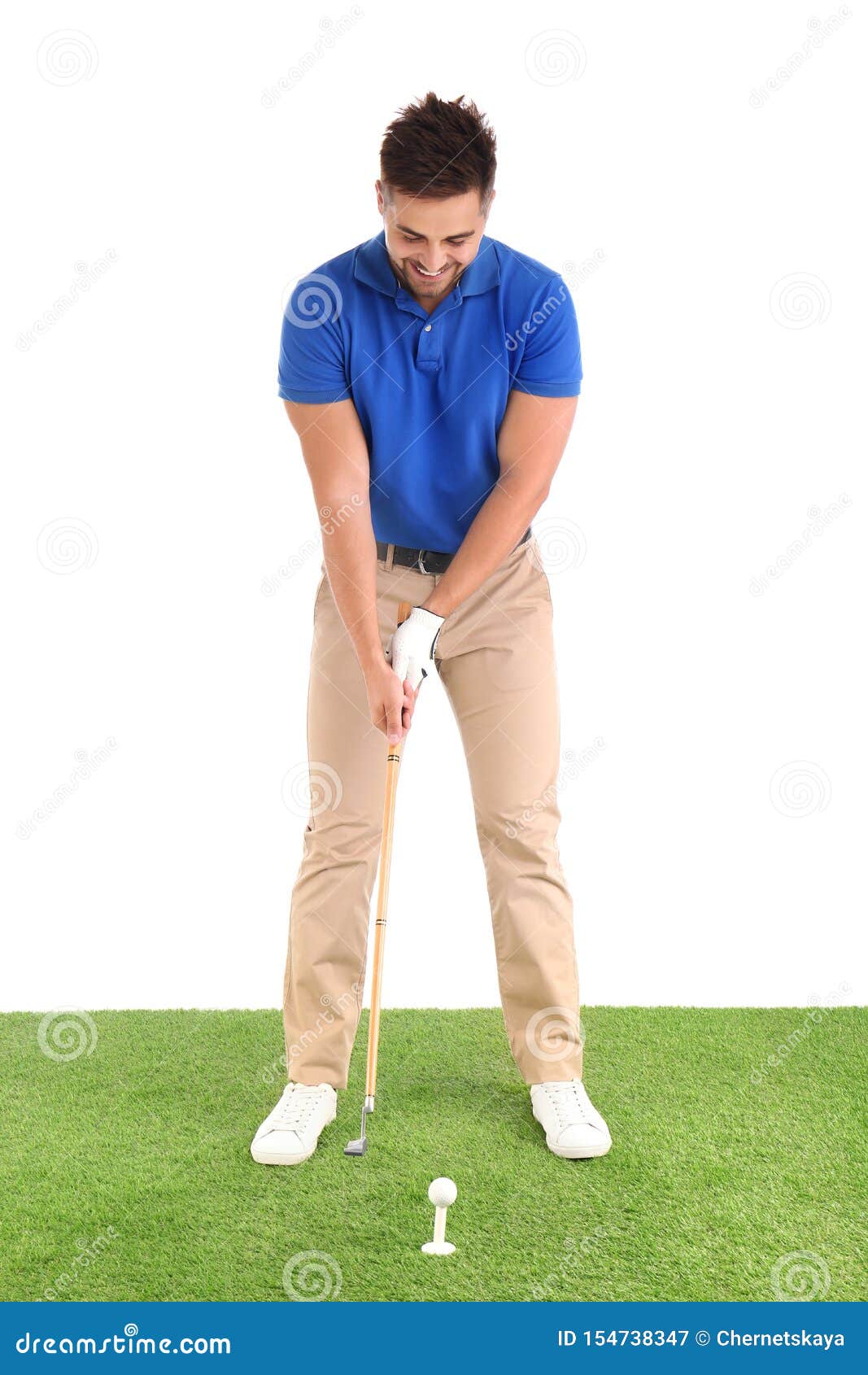 Young Man Playing Golf on Course Against White Stock Image - Image of ...