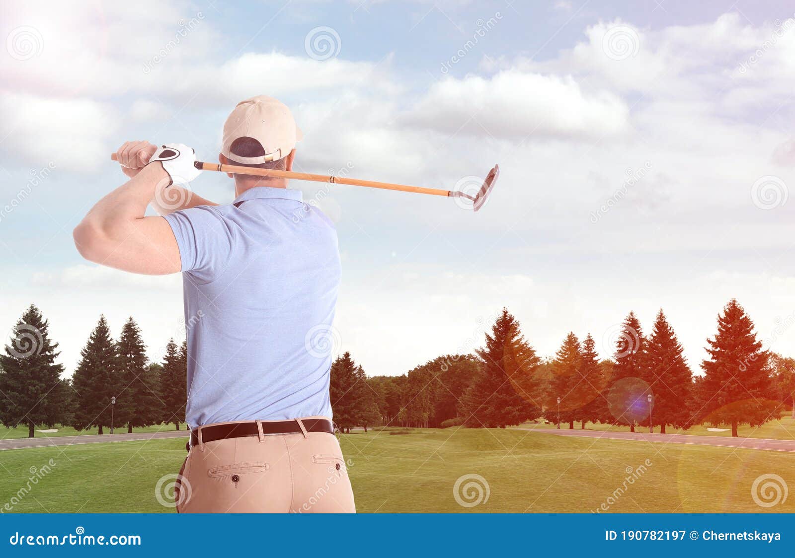 Young Man Playing Golf on Course with Grass, Back View. Space for ...