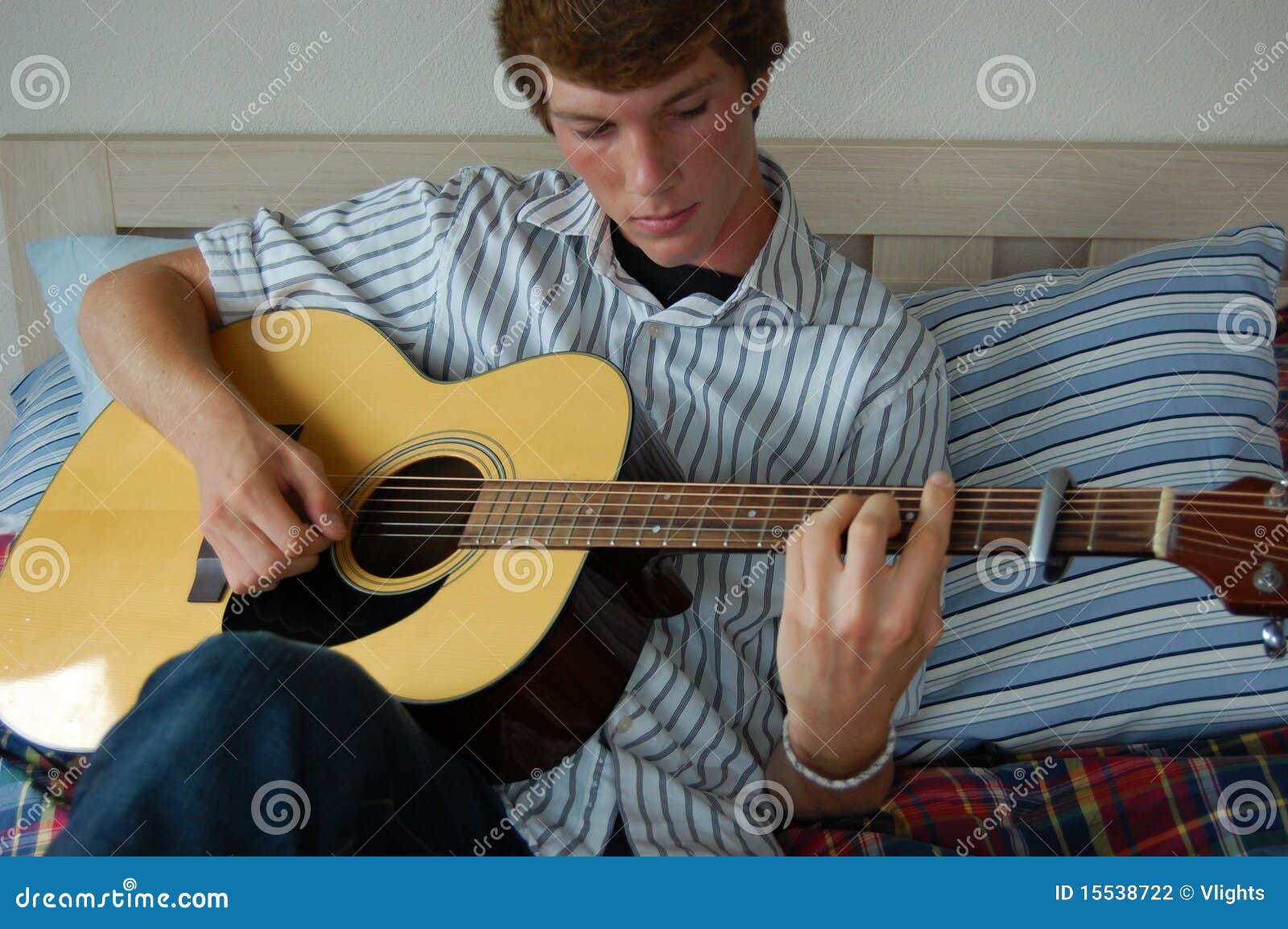 Young Man Playing Guitar stock photo. Image of acoustic - 15538722