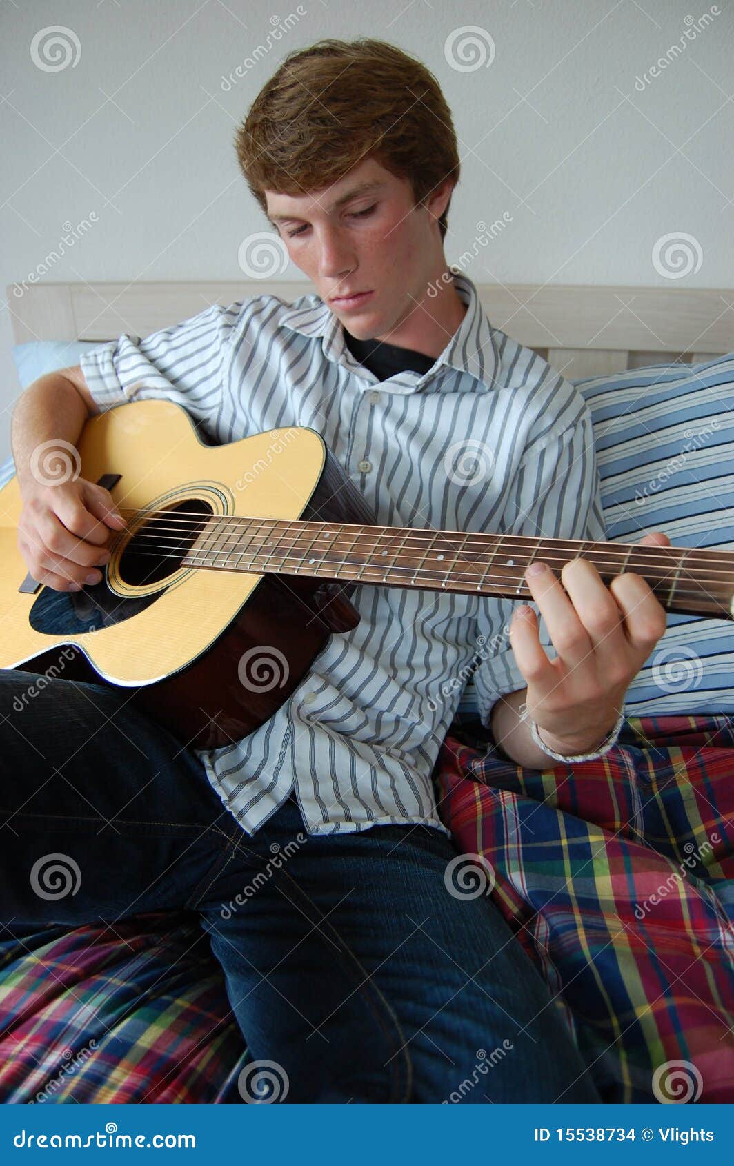 Young Man Playing Guitar stock photo. Image of leisure - 15538734